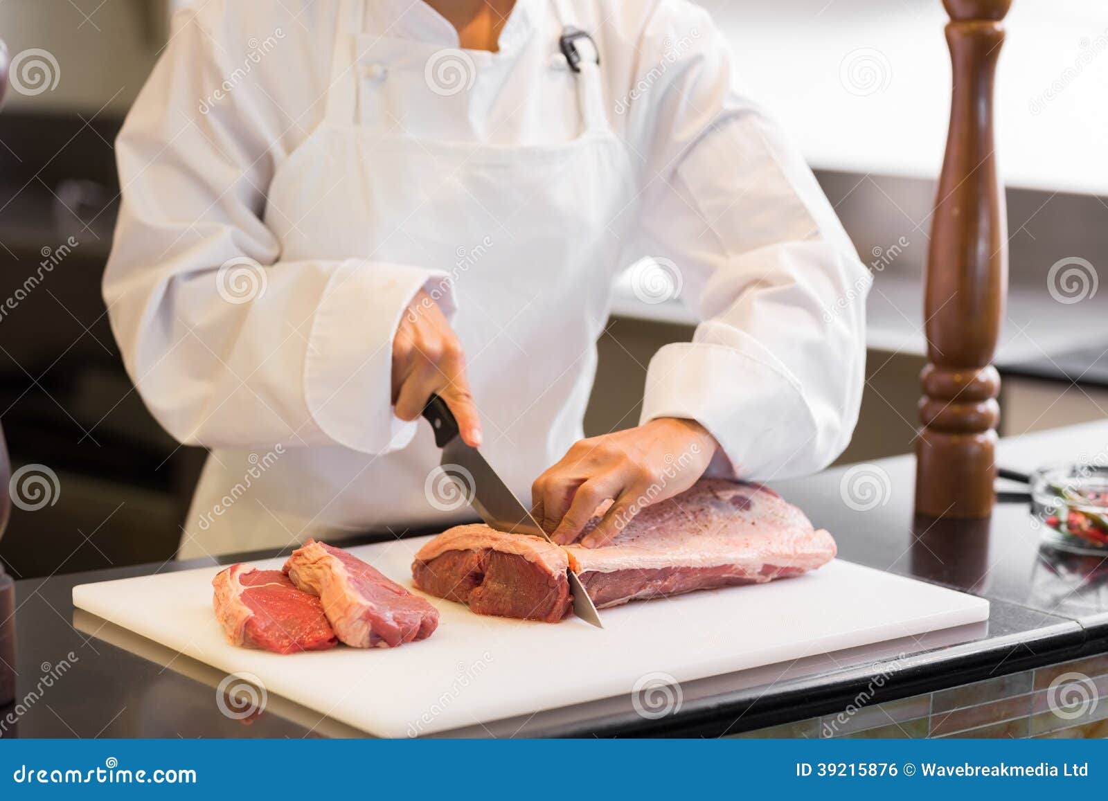 Mid Section of Hands Cutting Meat in Kitchen Stock Photo - Image of ...