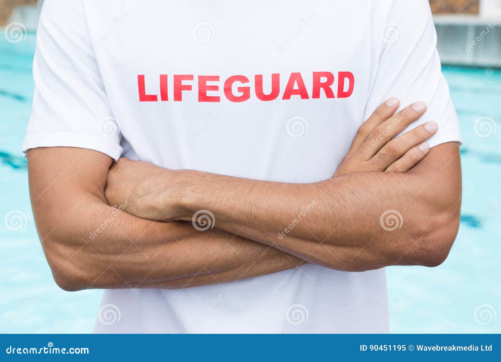 Mid Section of Lifeguard Standing with Arms Crossed Stock Image - Image ...