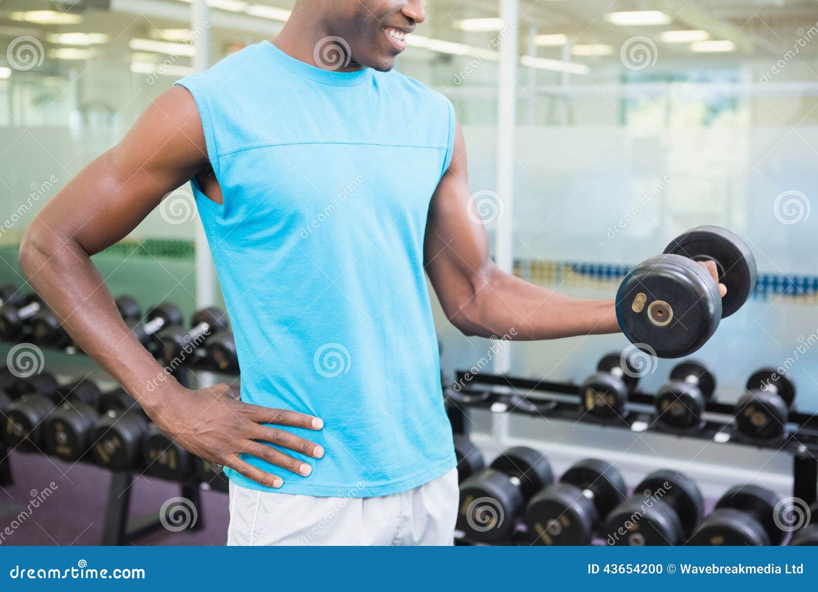 Mid Section of Man Exercising with Dumbbell in Gym Stock Photo - Image ...