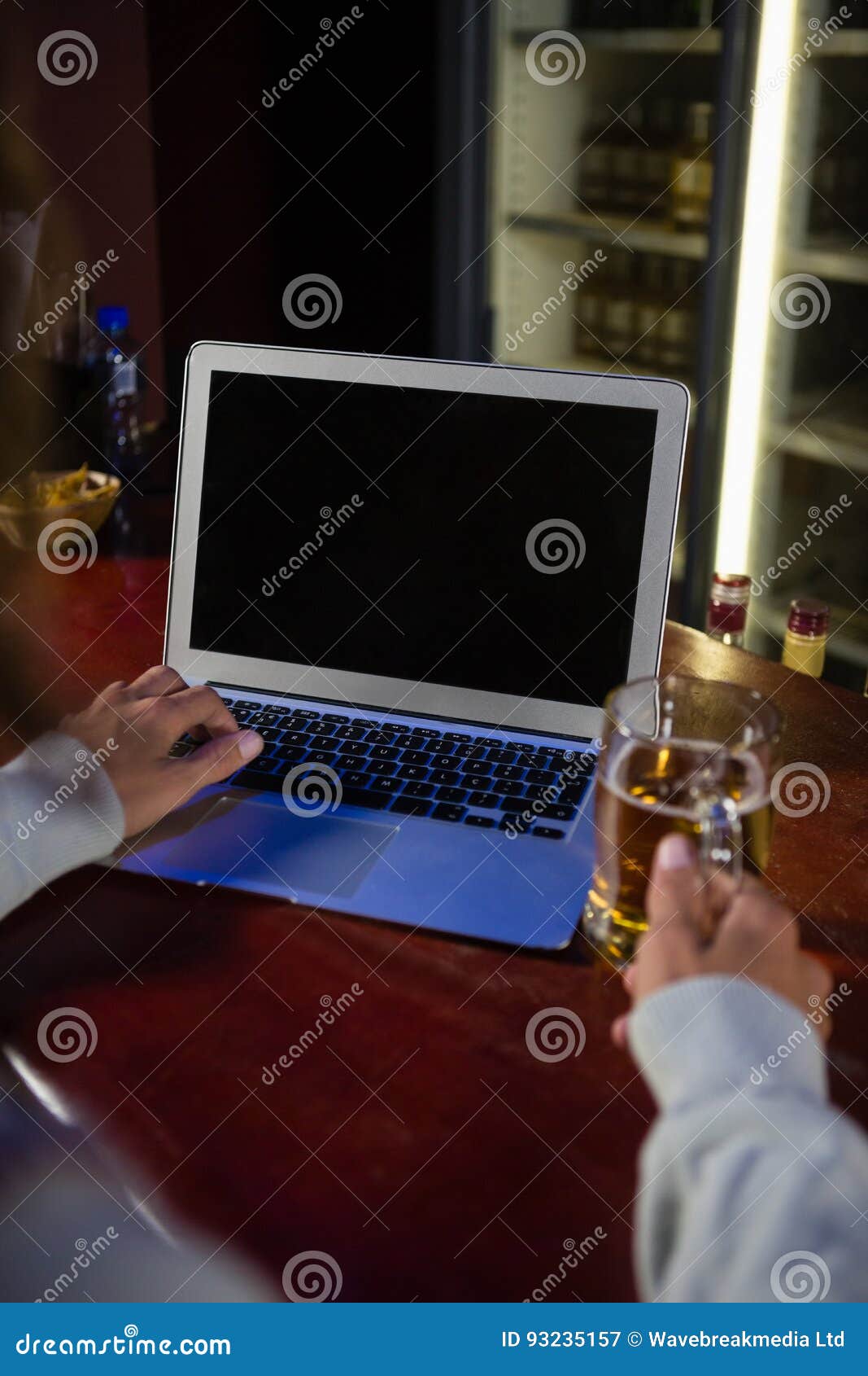 Mid-section Man Having Beer while Using Laptop at Counter Stock Image ...