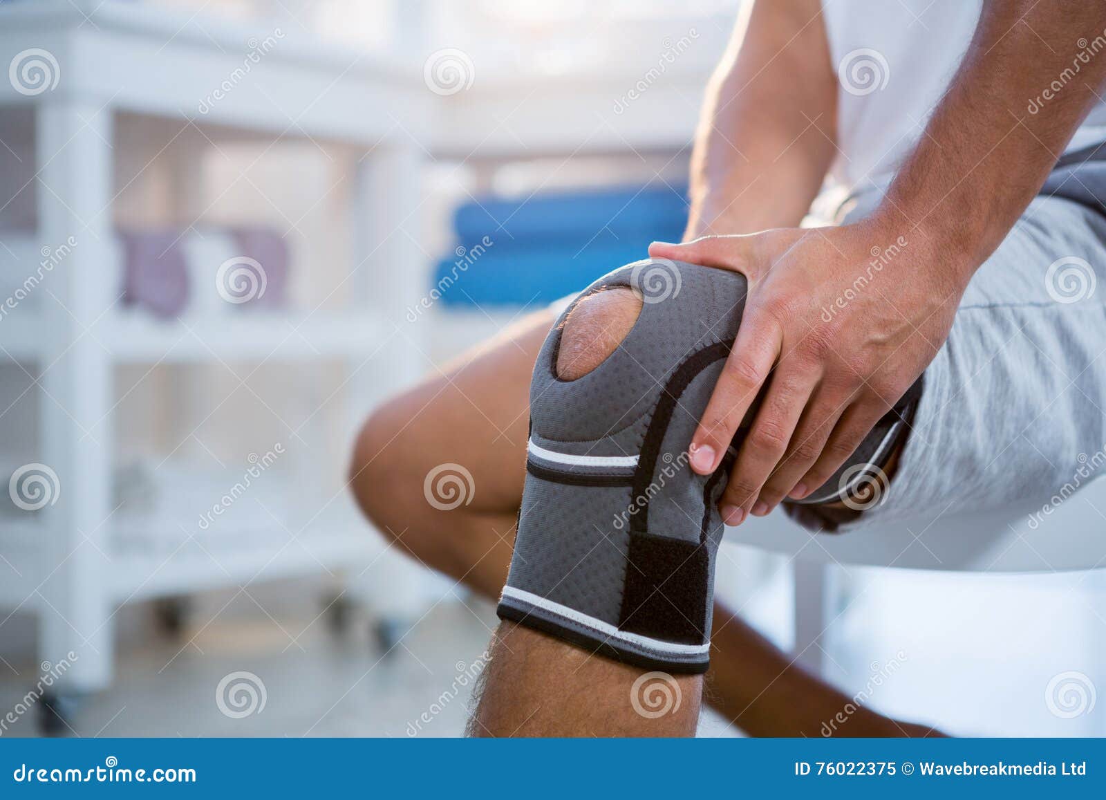 Mid Section of Man with Knee Injury Stock Image - Image of male ...