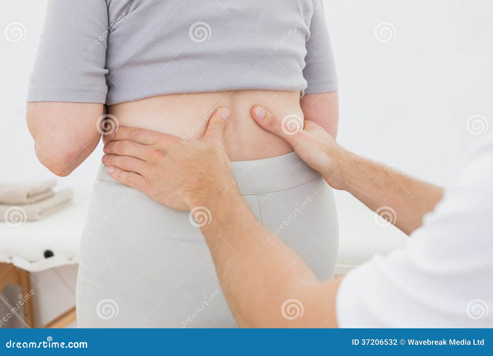 Mid Section of a Physiotherapist Examining Womans Back Stock Photo ...