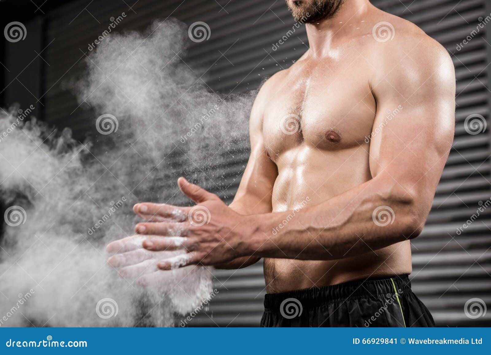 Mid Section of Shirtless Man Clapping Hands with Talc Stock Image ...