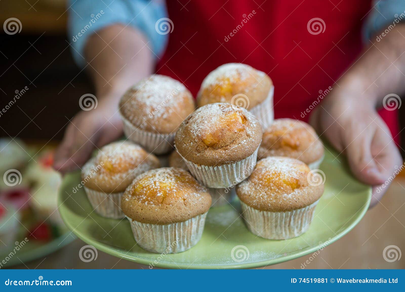 Mid Section of Staff Holding a Tray of Cupcakes Stock Image - Image of ...