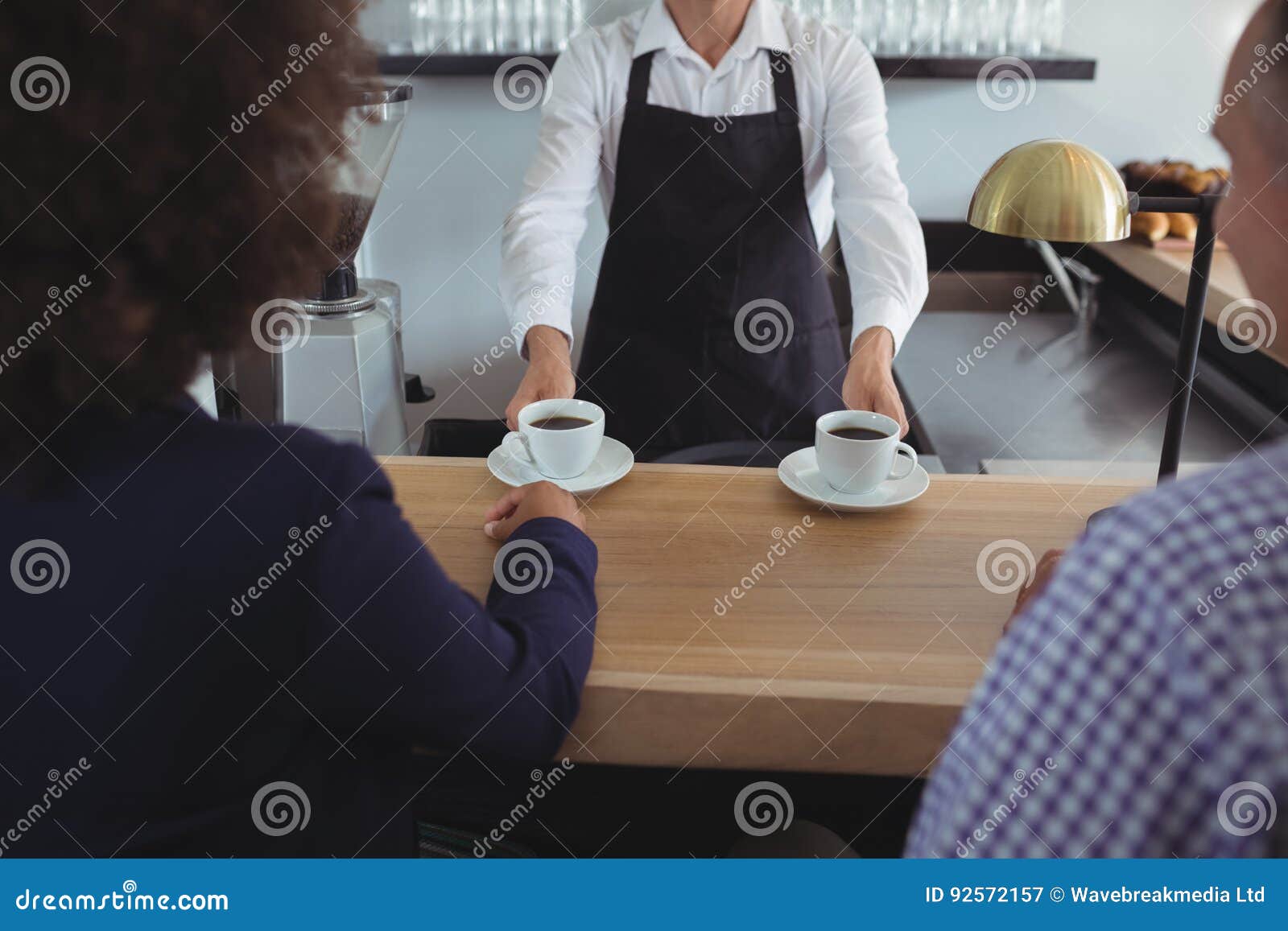 Mid Section of Waiter Serving Coffee To Customer at Counter Stock Image ...