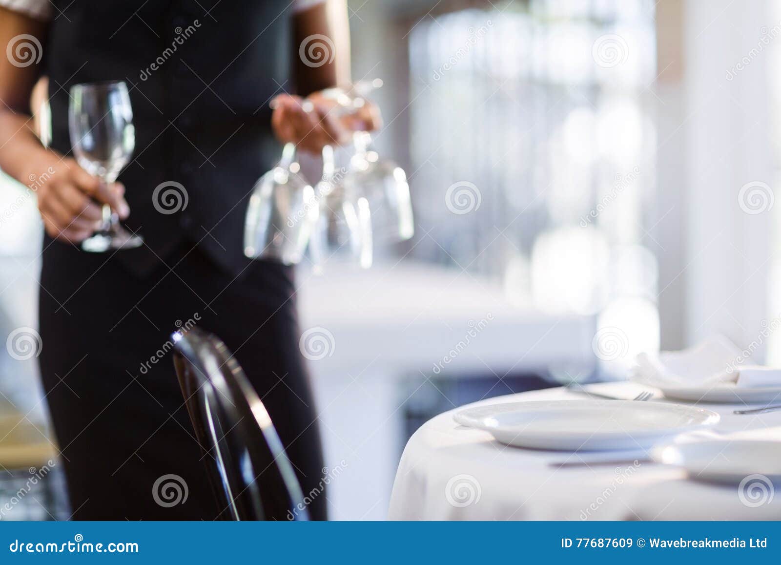Mid Section of Waitress Setting the Table Stock Image - Image of ...