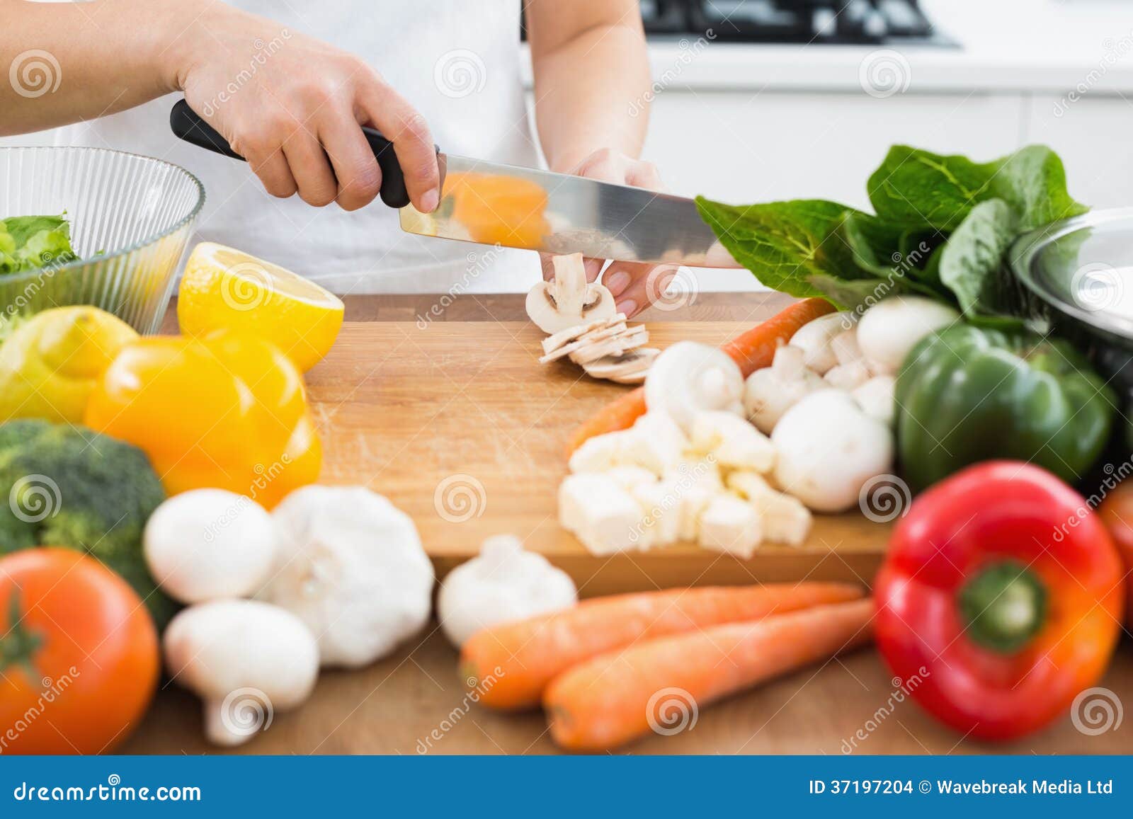 Mid Section of a Woman Chopping Vegetables in Kitchen Stock Photo ...