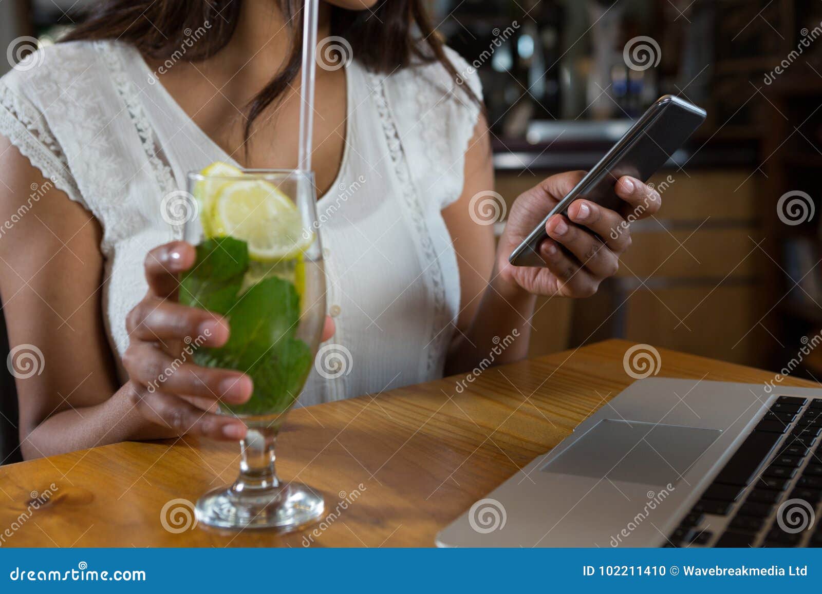 Woman Using Mobile Phone at Bar Stock Photo - Image of computer, food ...