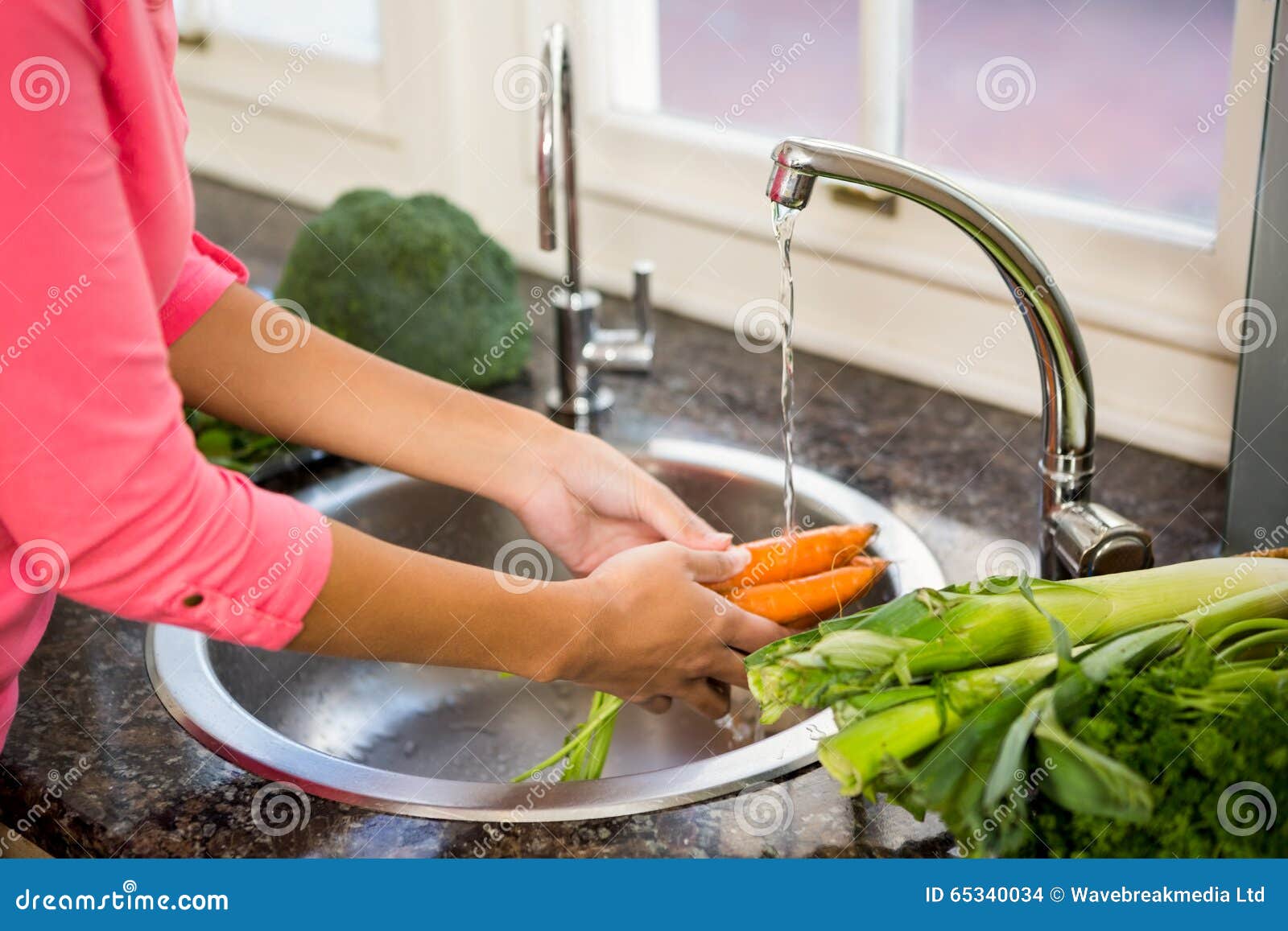 Mid Section of Woman Washing Carrots Stock Photo - Image of life ...