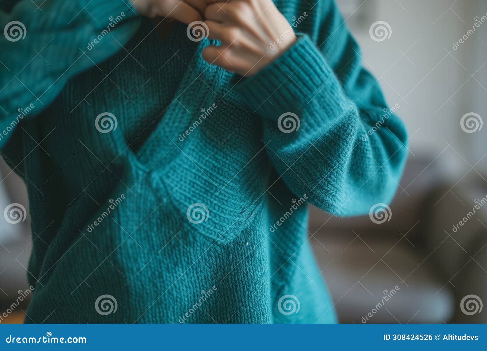 Midaction, Person Pulling on a Teal Sweater, Uncluttered Environment ...