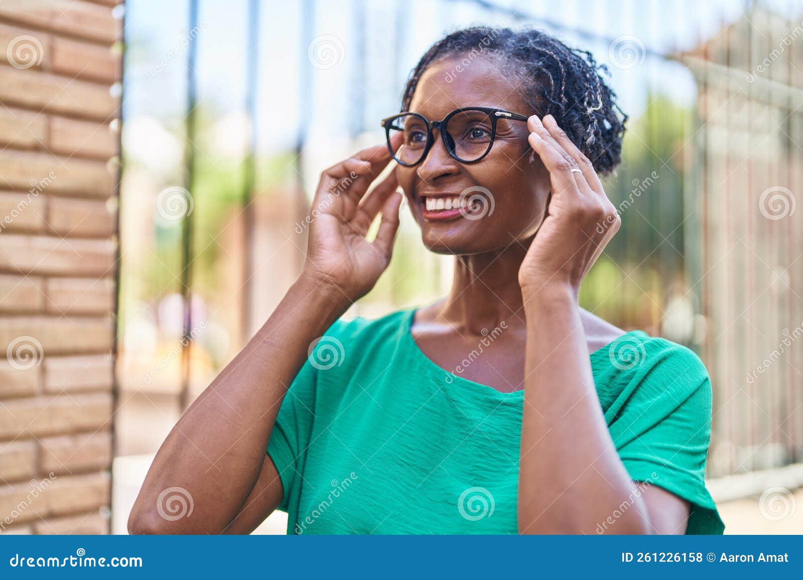 Middle Age African American Woman Smiling Confident Wearing Glasses At