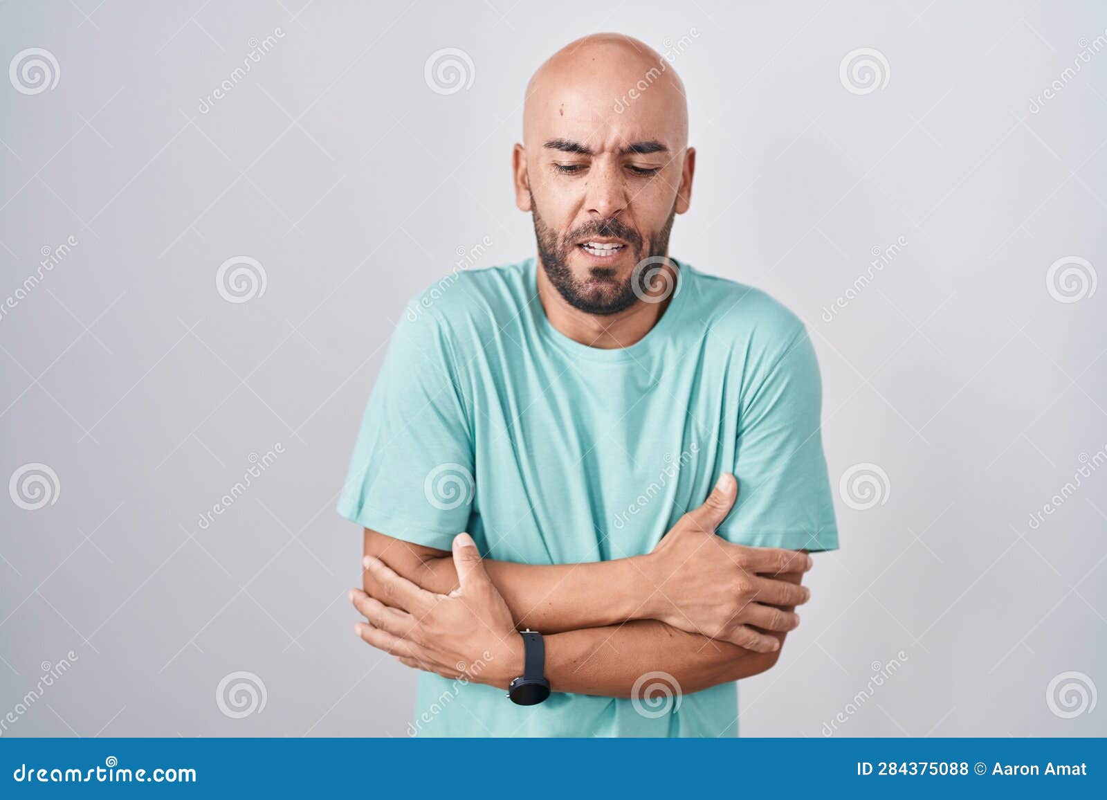 Middle Age Bald Man Standing Over White Background Shaking and Freezing ...