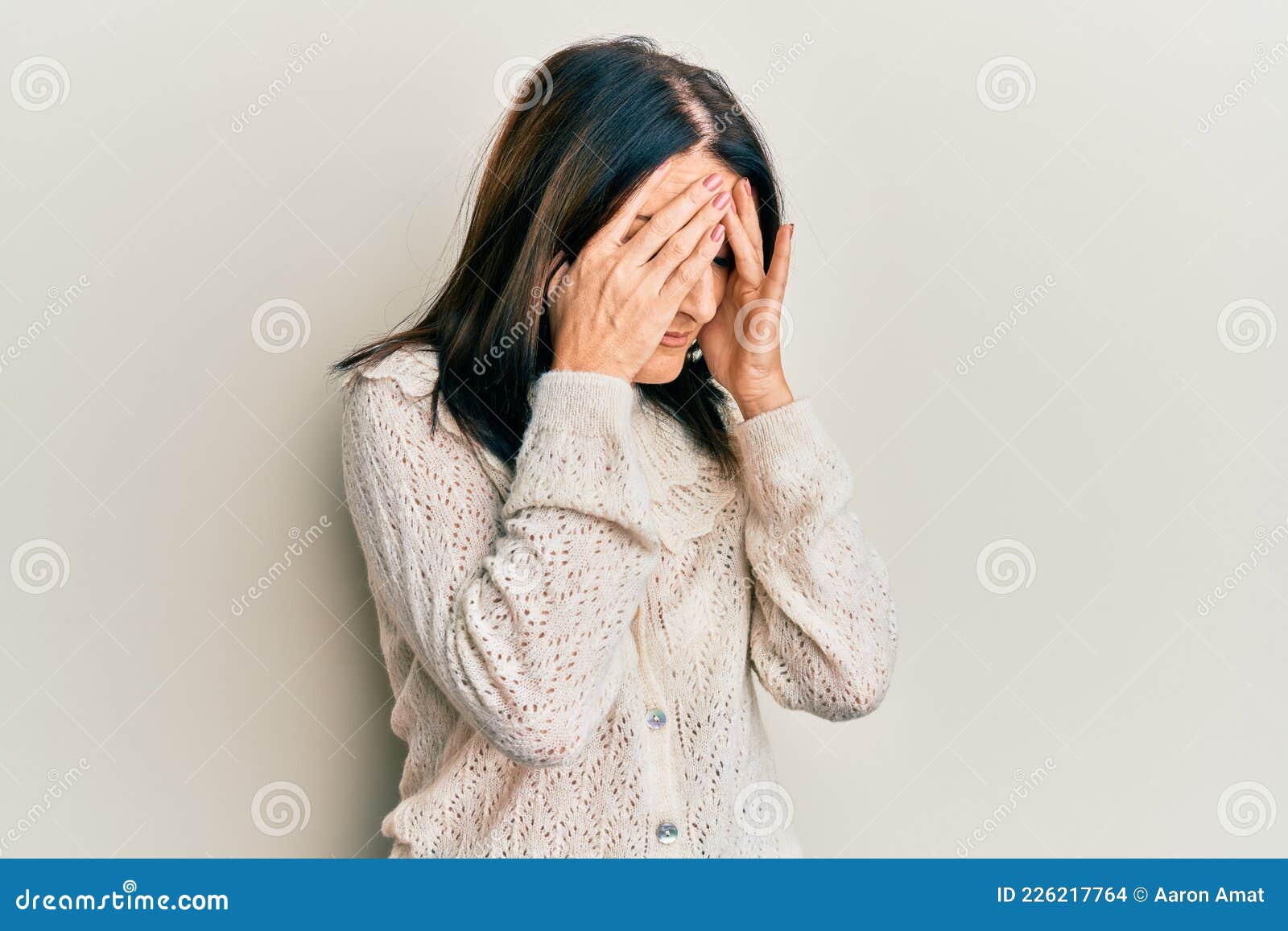 Middle Age Brunette Woman Wearing Casual Clothes With Sad Expression