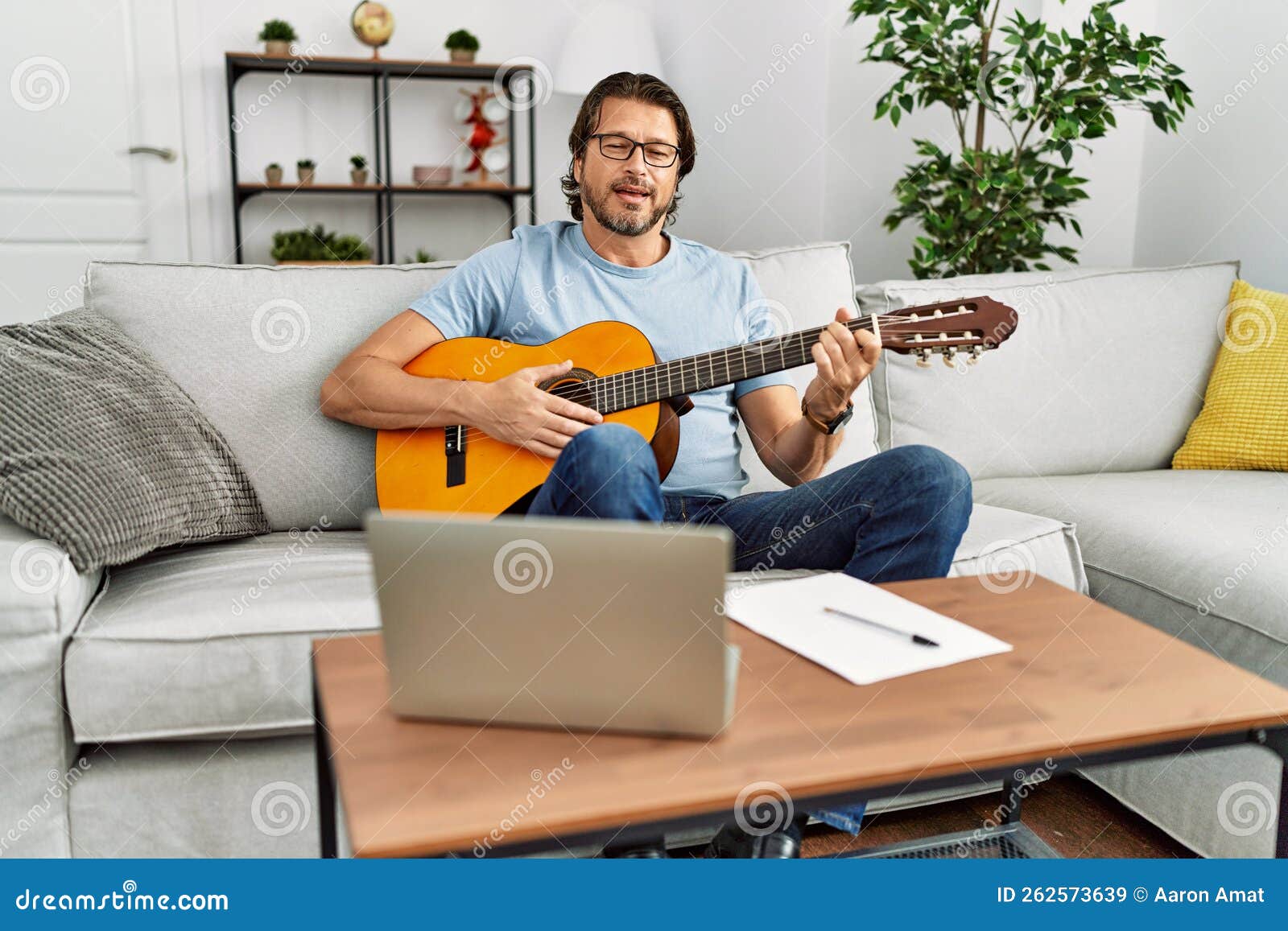 Middle Age Caucasian Man Playing Classical Guitar at Home Stock Image ...