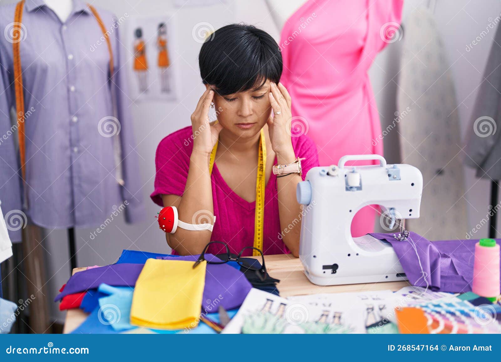 Middle Age Chinese Woman Tailor Stressed Using Sewing Machine at ...
