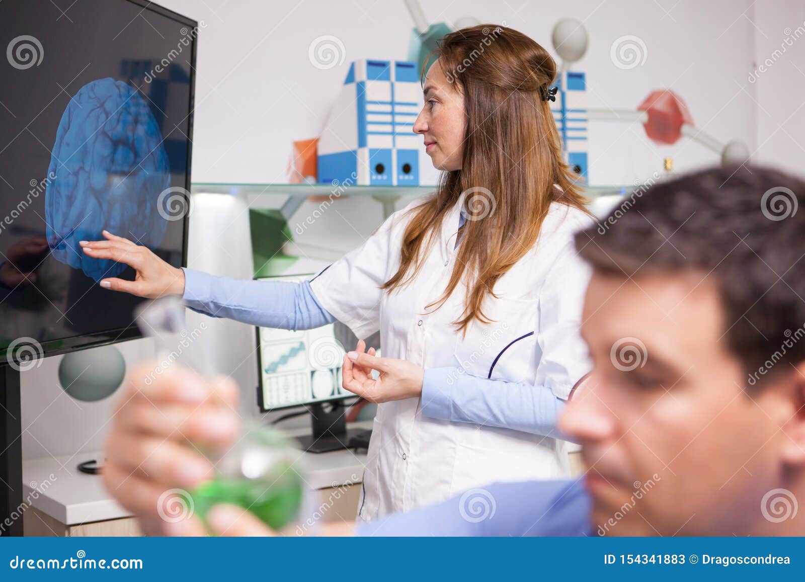 Middle Age Female Scientist Doing Advanced Analysis on Human Brain ...