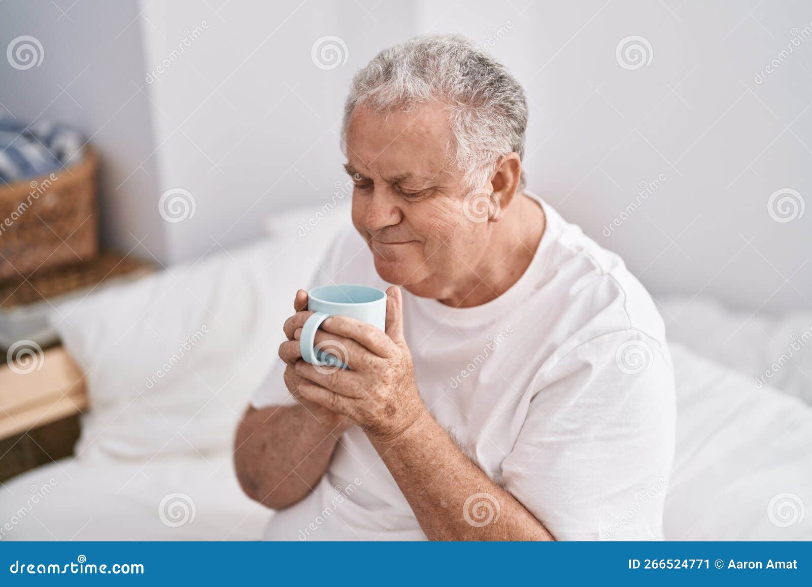 Middle Age Grey-haired Man Drinking Cup of Coffee Sitting on Bed at ...