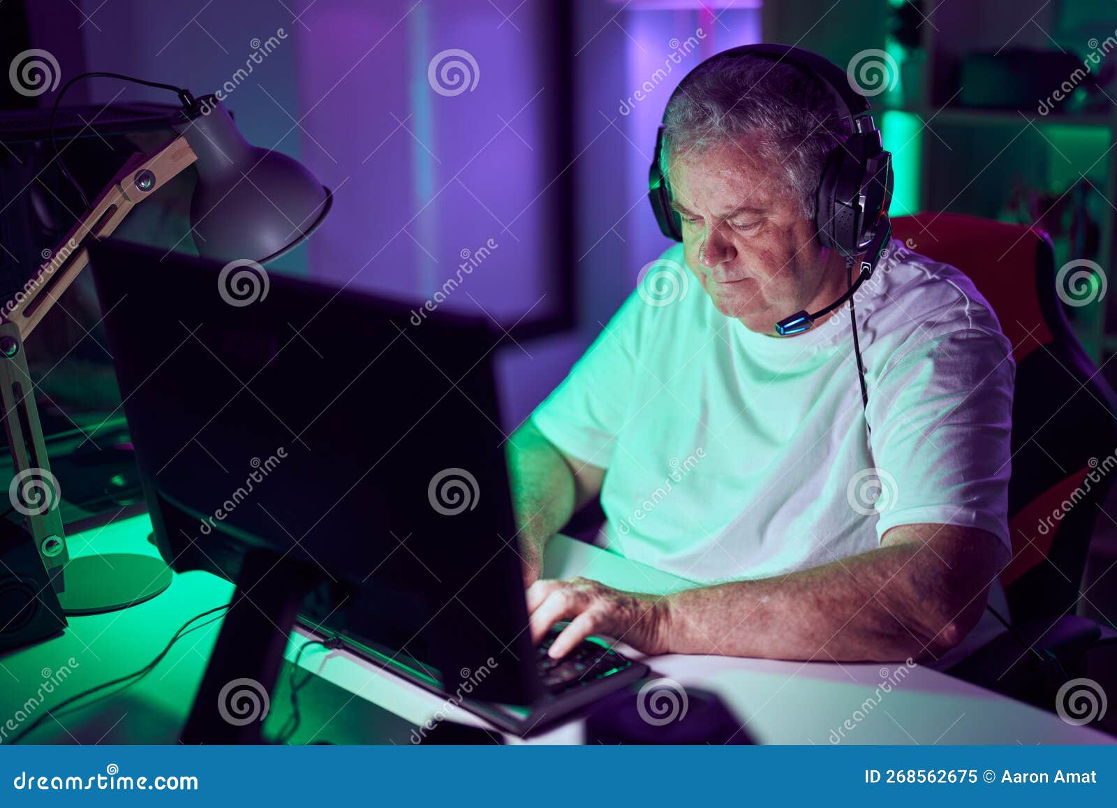 Middle Age Grey-haired Man Streamer Playing Video Game Using Computer ...