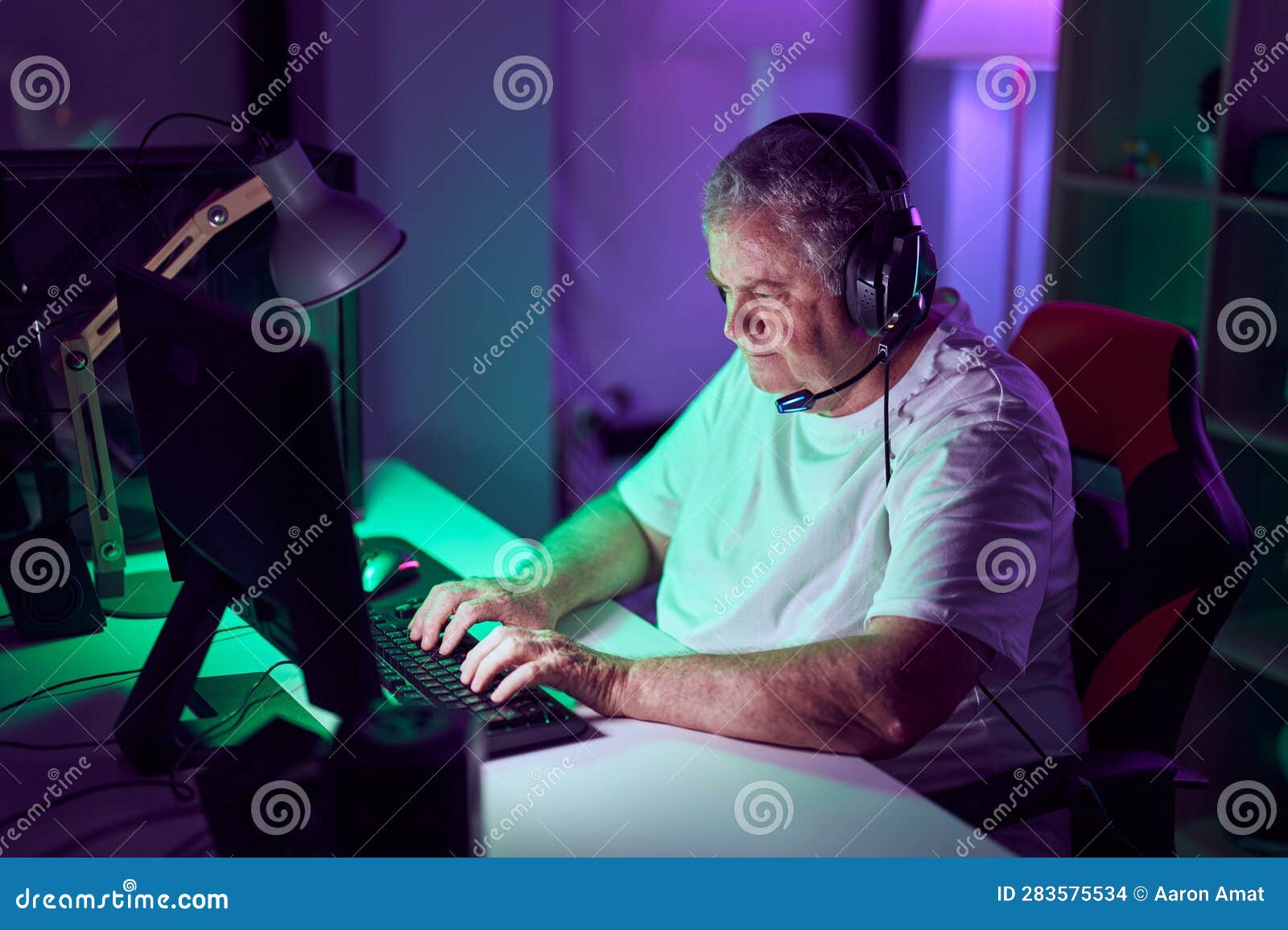 Middle Age Grey-haired Man Streamer Playing Video Game Using Computer ...