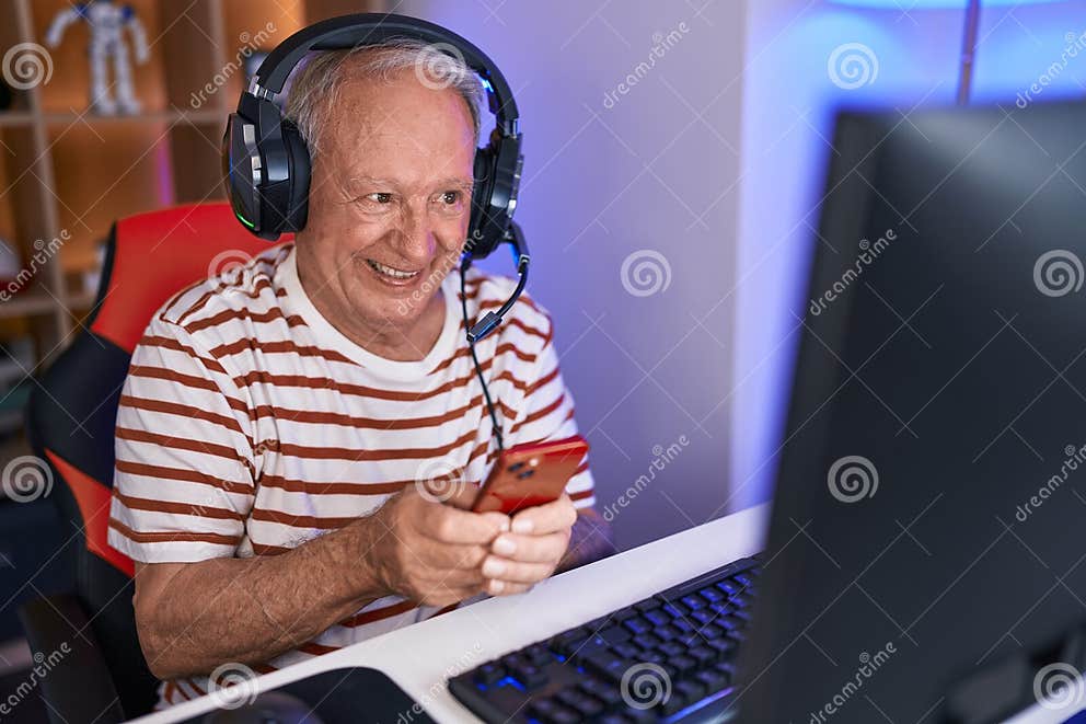 Middle Age Grey-haired Man Streamer Using Computer and Smartphone at Gaming Room Stock Image ...