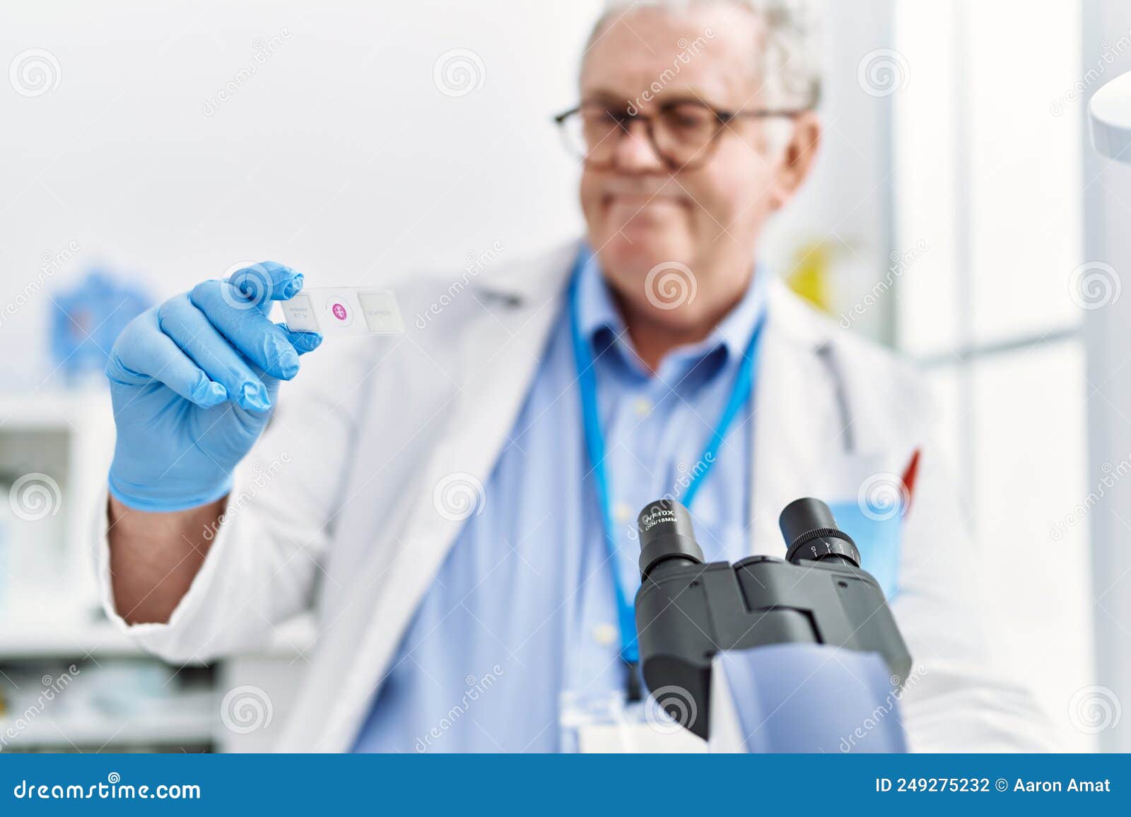 Middle Age Grey-haired Man Wearing Scientist Uniform Using Microscope ...