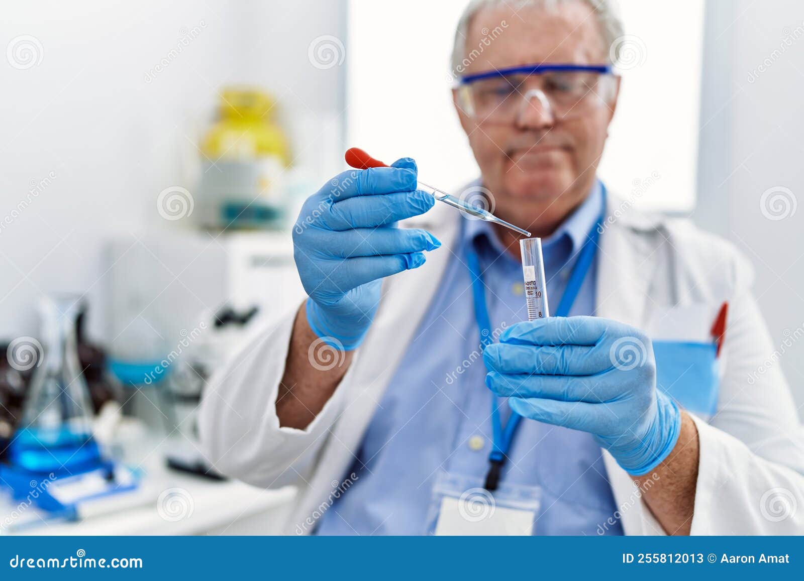 Middle Age Grey-haired Man Wearing Scientist Uniform Using Pipette at ...