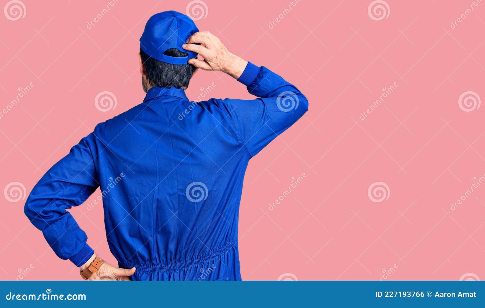 Mechanic In Red Uniform Work With Lifted Vehicle, Inspect Car Engine ...