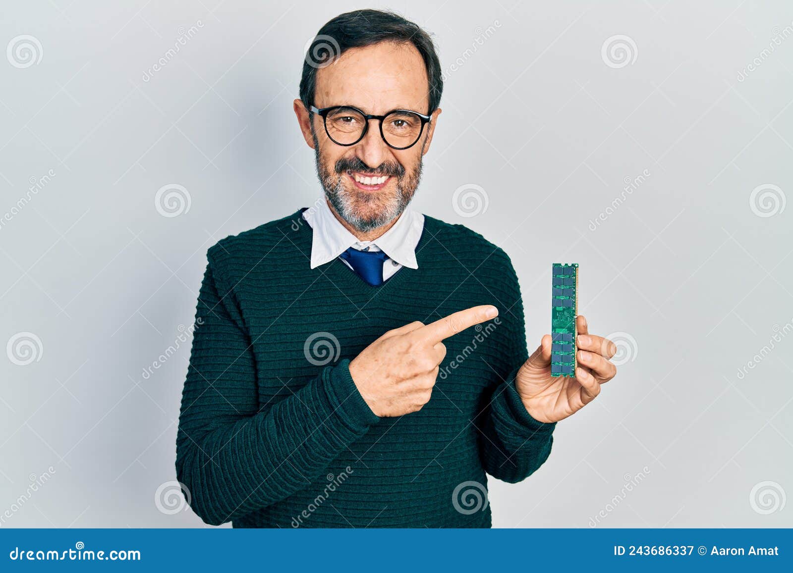 Middle Age Hispanic Man Holding Memory Ram Smiling Happy Pointing with ...