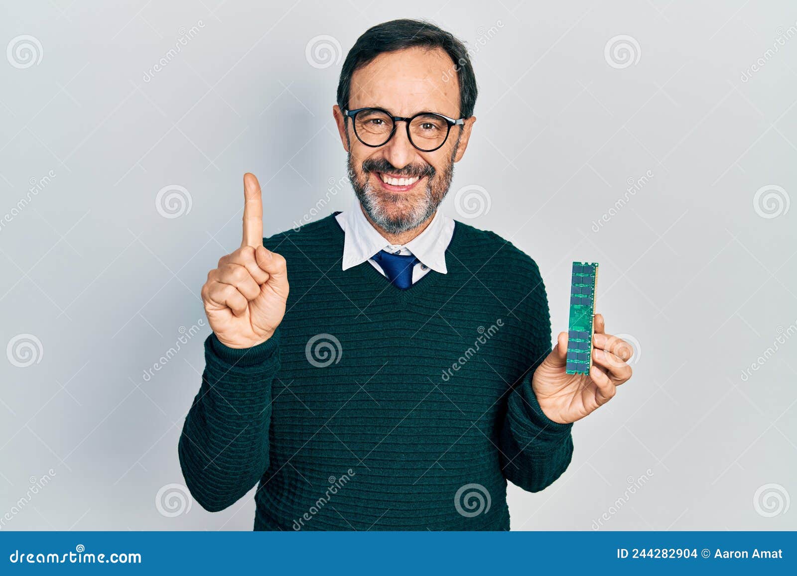 Middle Age Hispanic Man Holding Memory Ram Smiling with an Idea or ...