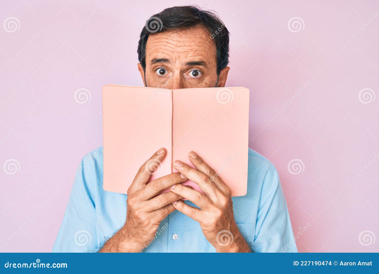 Middle Age Hispanic Man Reading Book Clueless and Confused Expression ...