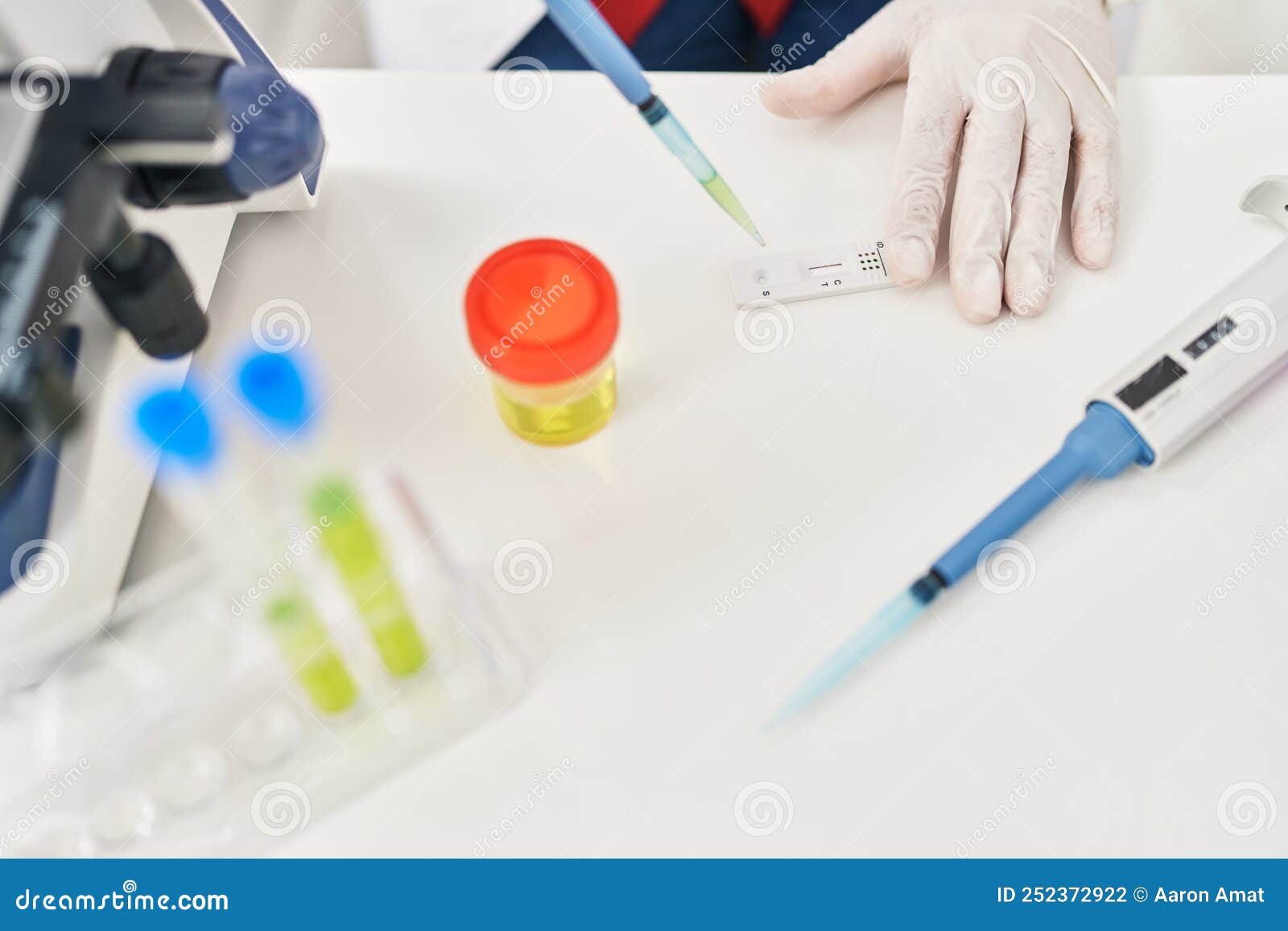 Middle Age Hispanic Woman Doing Urine Test at Laboratory Stock Photo ...