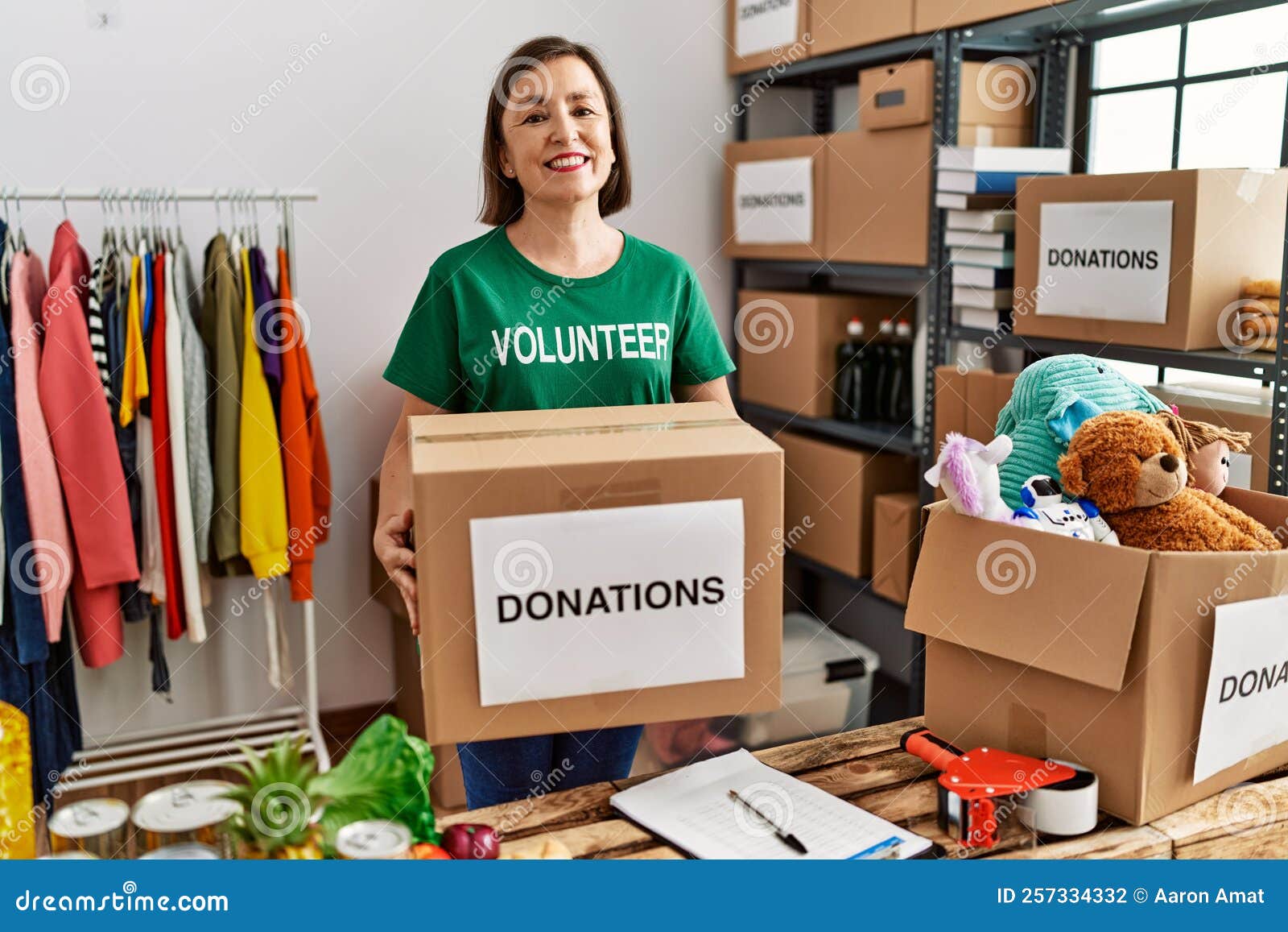 Middle Age Hispanic Woman Holding Donations Box at Donations Stand ...