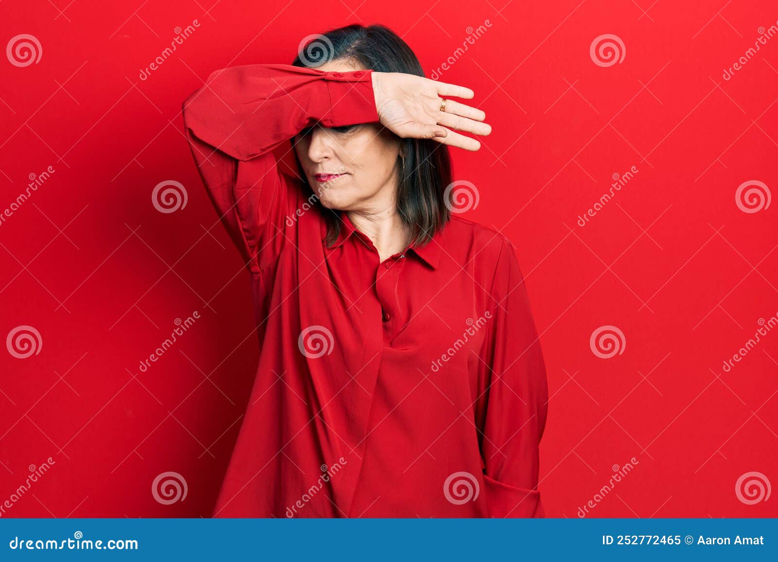 Middle Age Hispanic Woman Wearing Casual Clothes Covering Eyes With Arm
