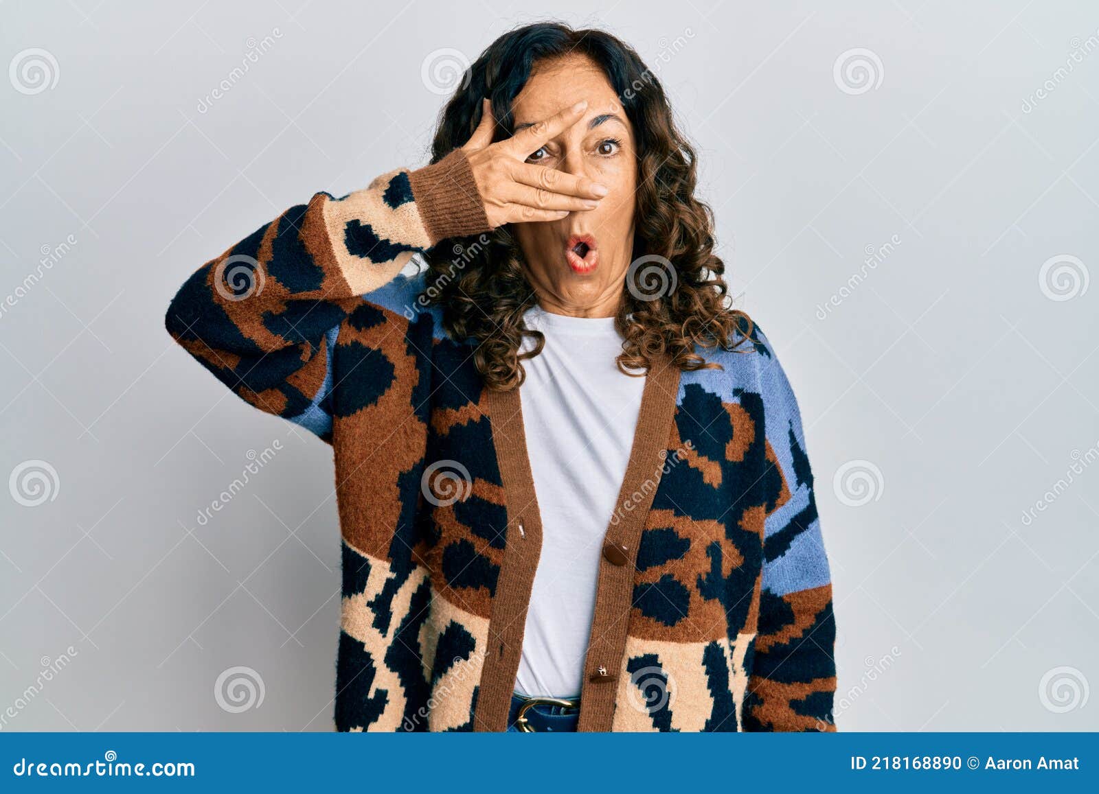 Middle Age Hispanic Woman Wearing Casual Clothes Peeking In Shock