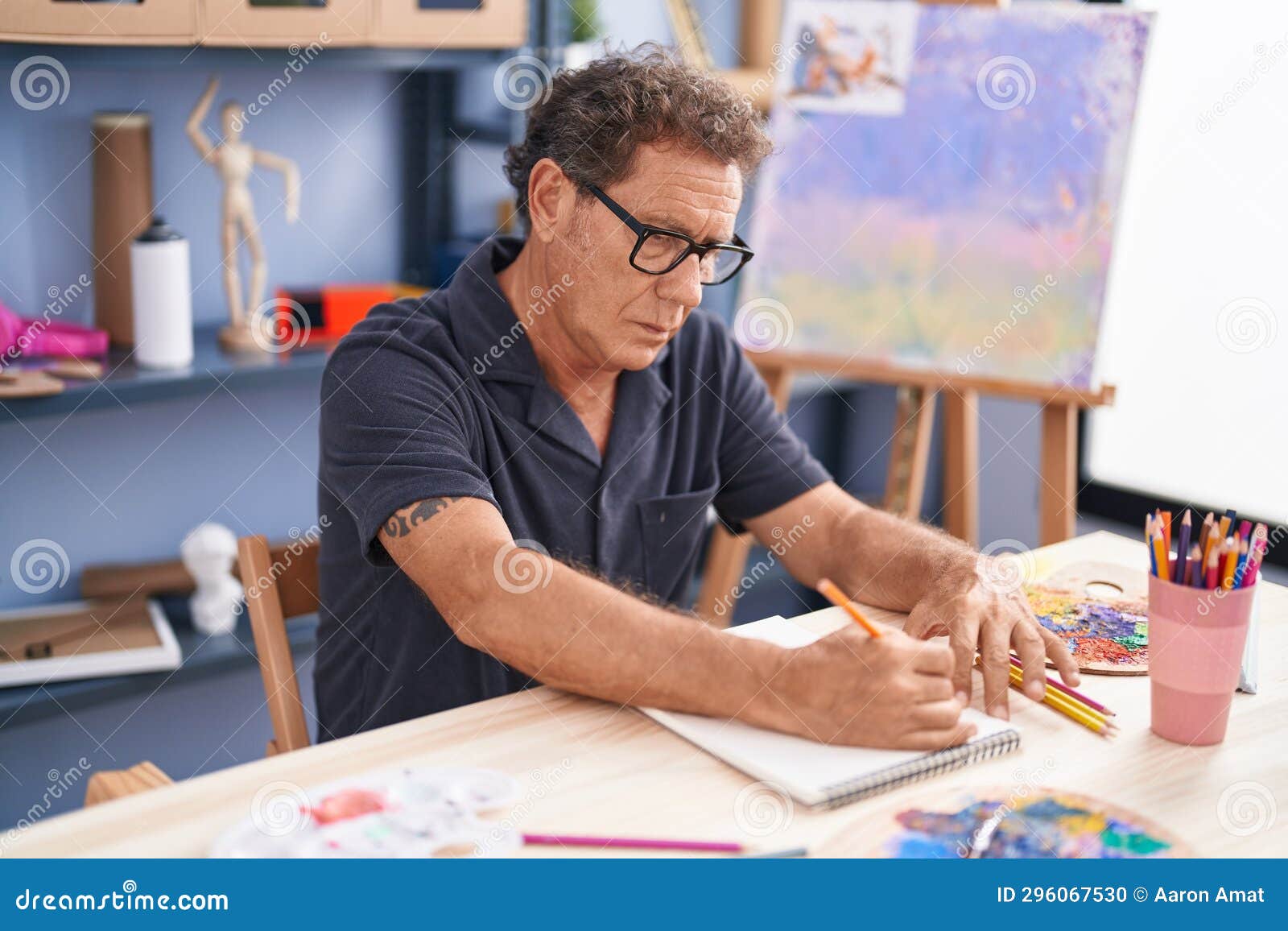Middle Age Man Artist Drawing on Notebook at Art Studio Stock Photo ...
