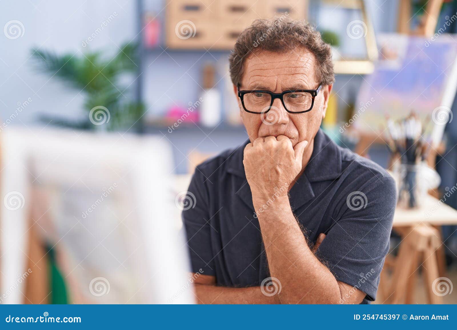 Middle Age Man Artist Looking Draw with Doubt Expression at Art Studio ...