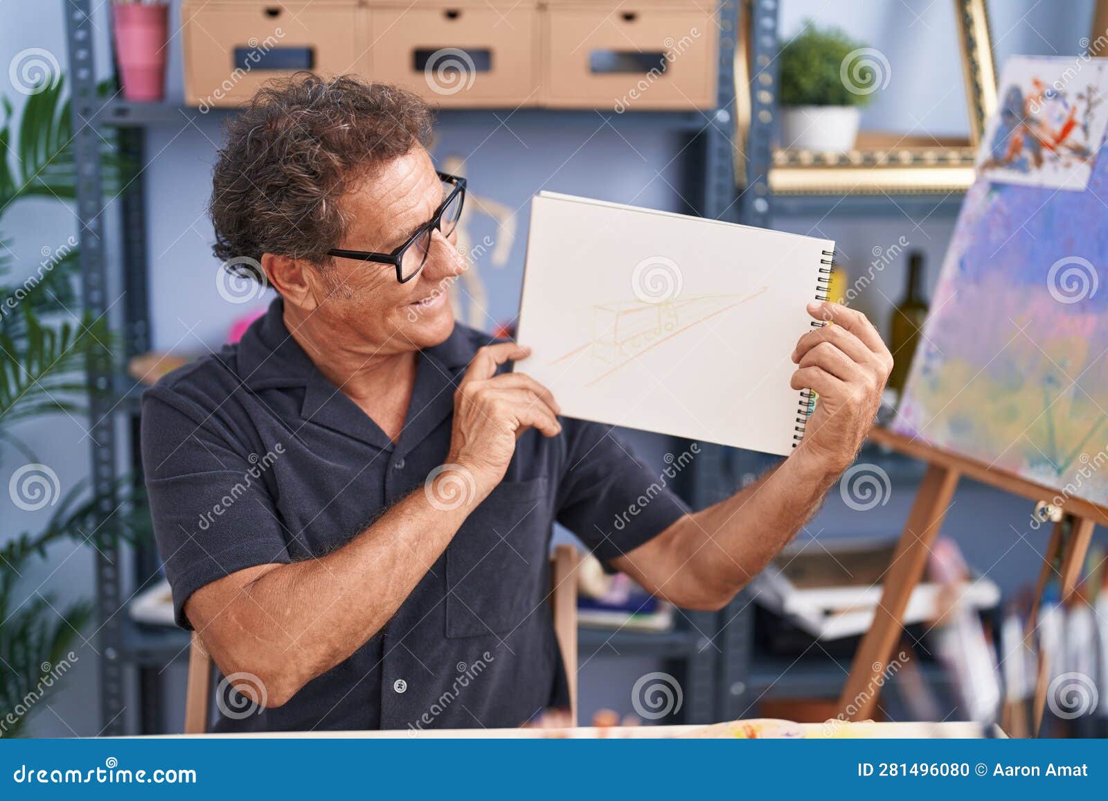 Middle Age Man Artist Smiling Confident Showing Draw at Art Studio ...