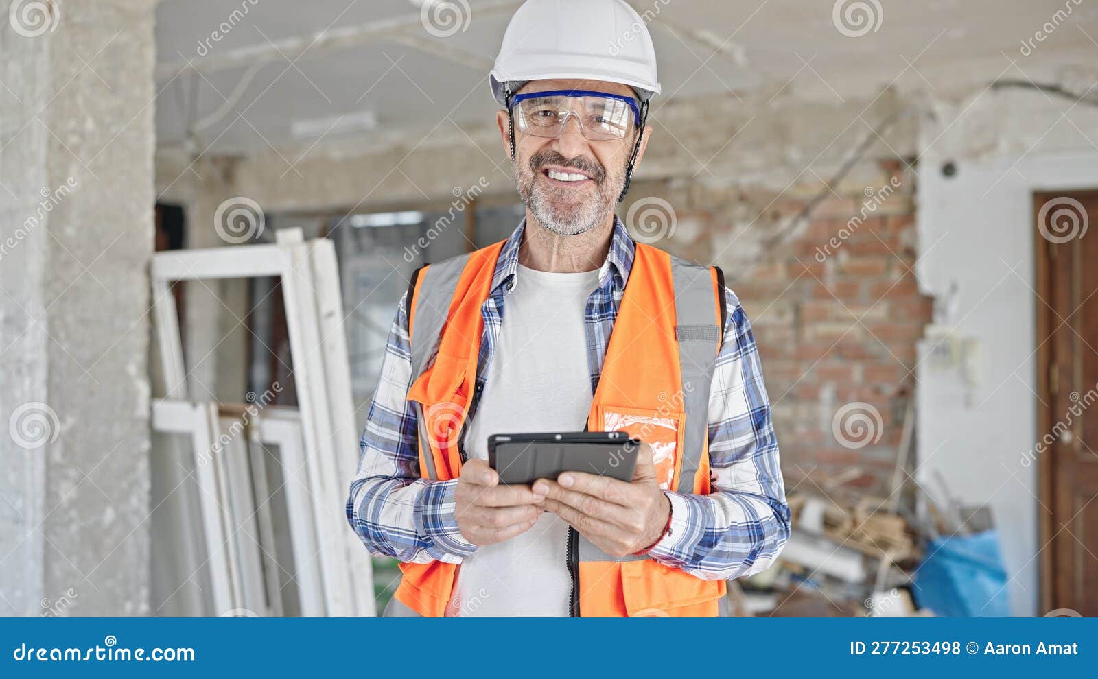Middle Age Man Builder Smiling Confident Using Touchpad at Construction ...