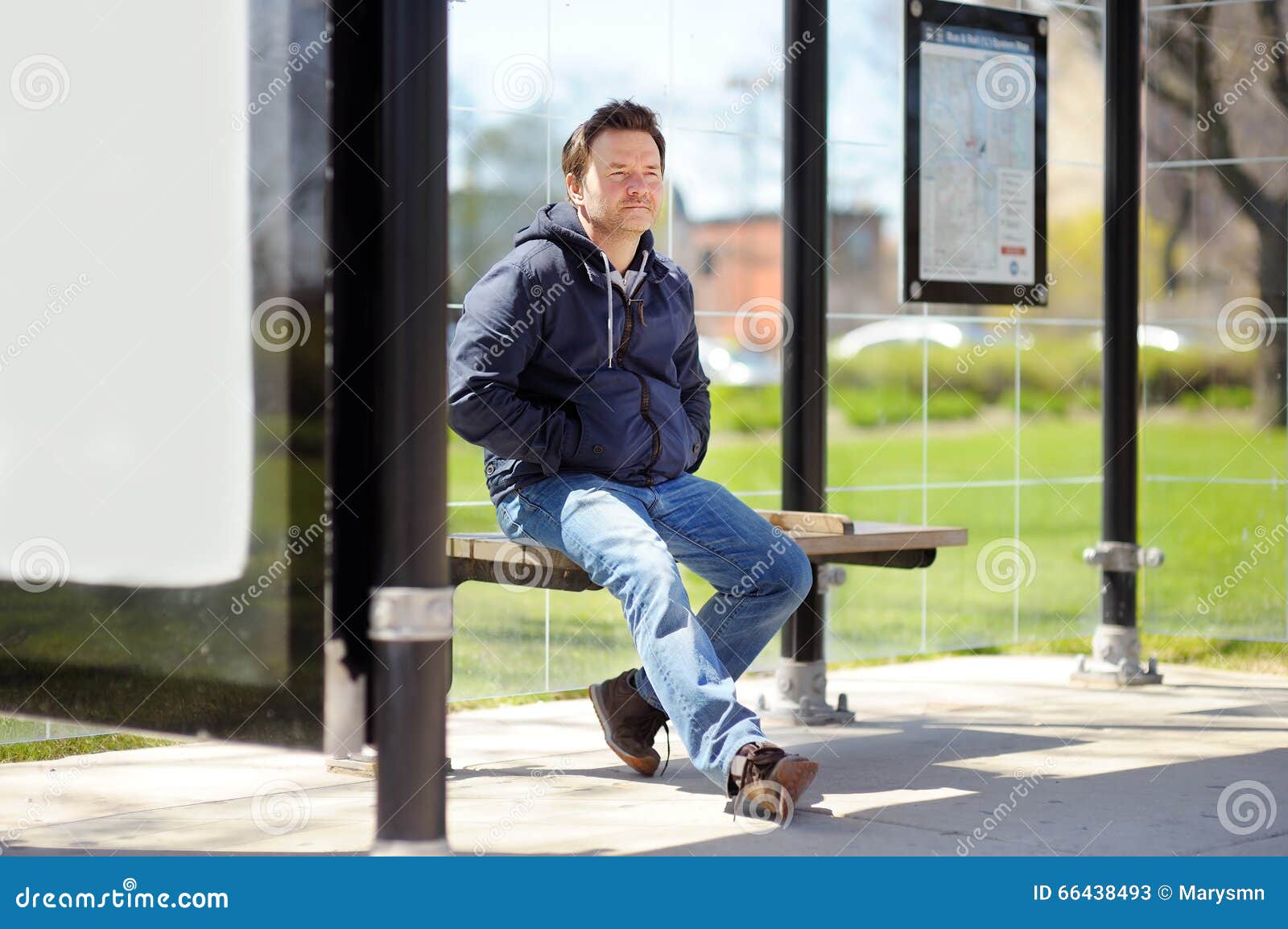 Middle age man on bus stop stock image. Image of commuting - 66438493