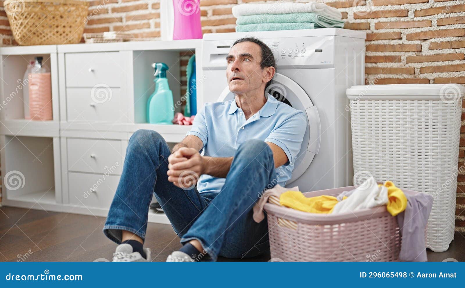 Middle Age Man Leaning on Washing Machine with Stressed at Laundry Room ...