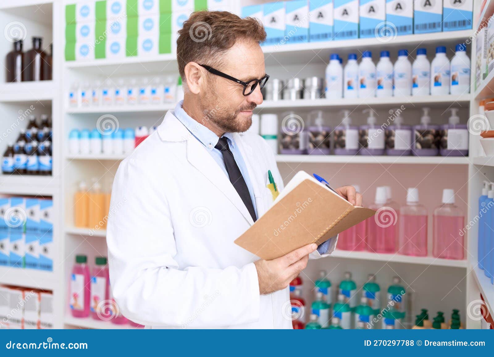 Middle Age Man Pharmacist Reading Book at Pharmacy Stock Photo - Image ...