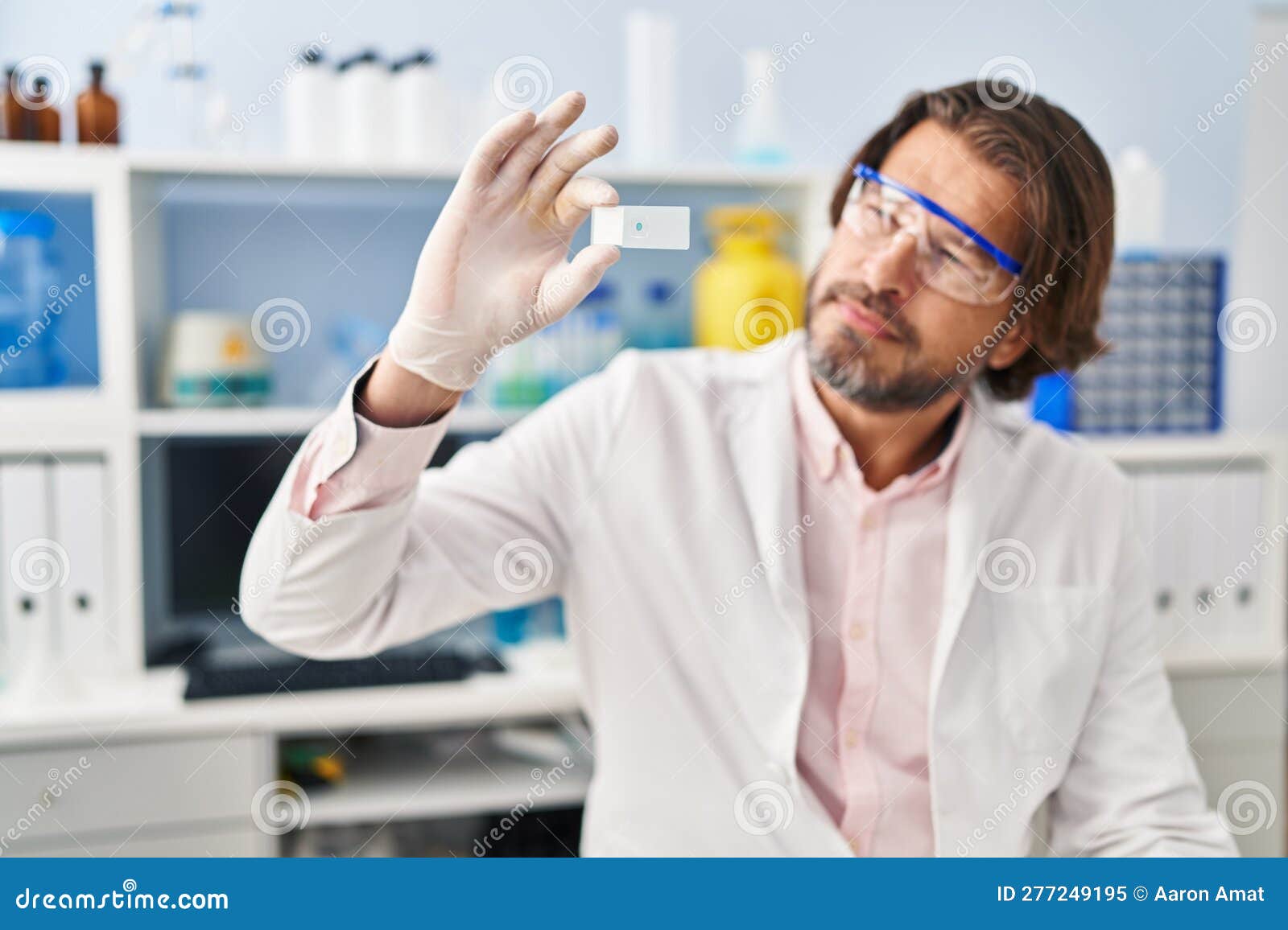 Middle Age Man Scientist Holding Sample at Laboratory Stock Image ...