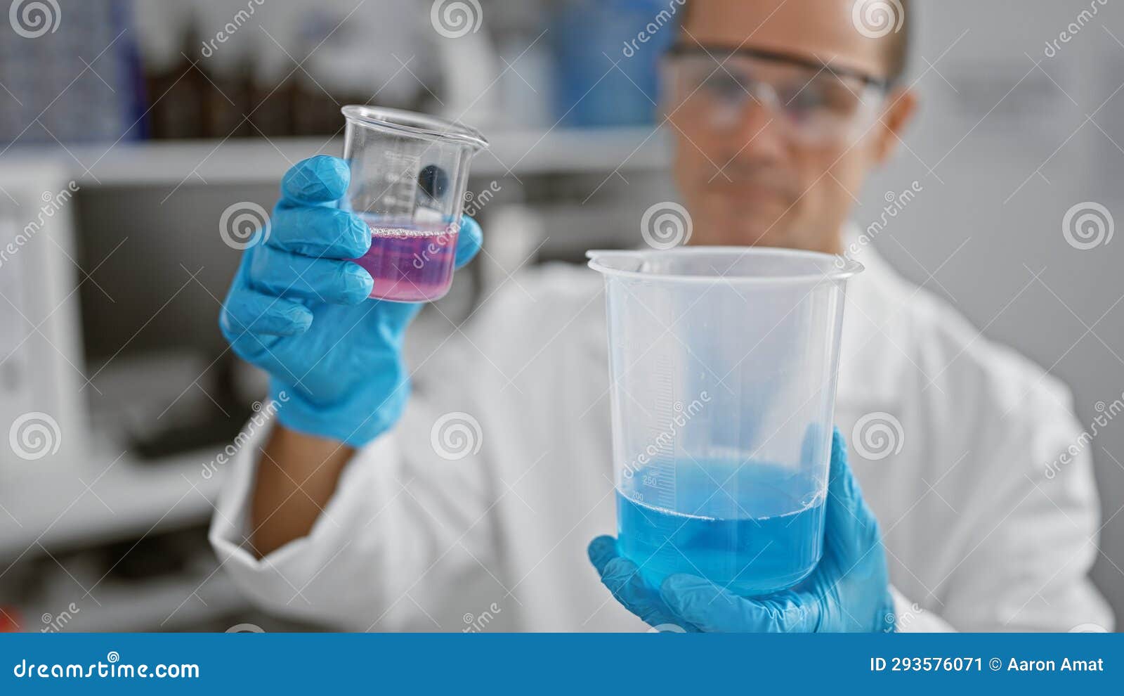 Middle Age Man Scientist Measuring Liquid at Laboratory Stock Image ...