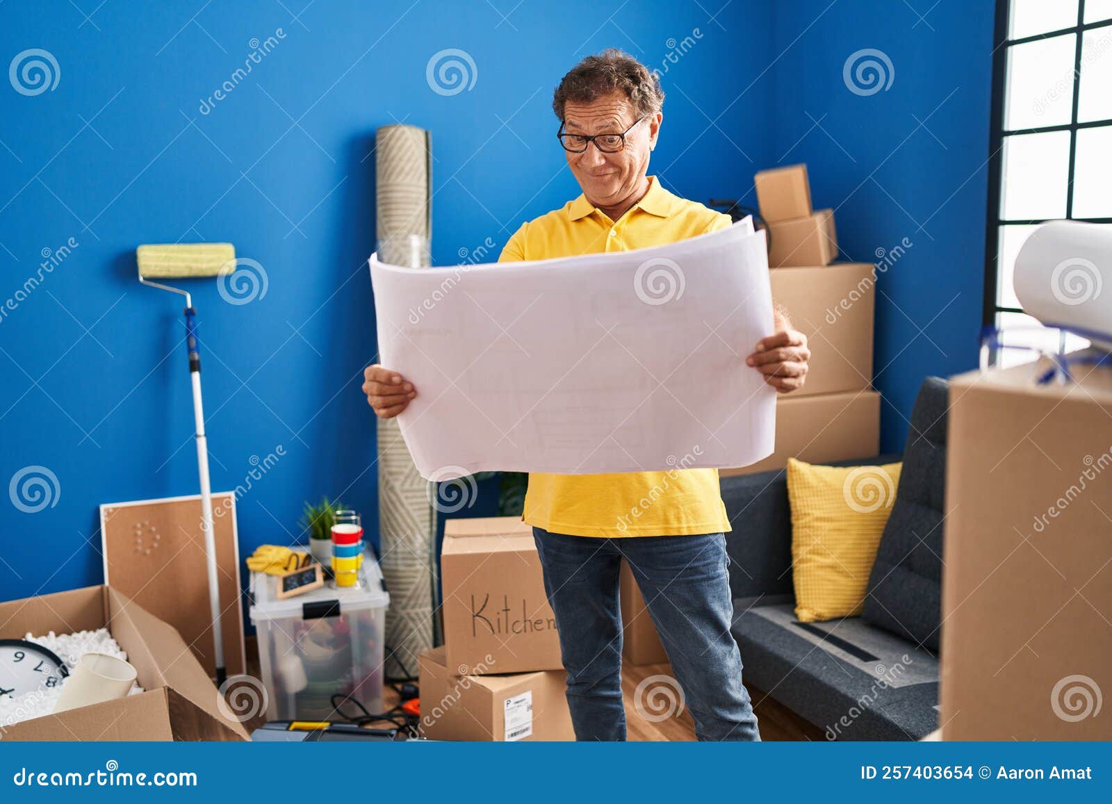 Middle Age Man Smiing Confident Looking House Project at New Home Stock ...