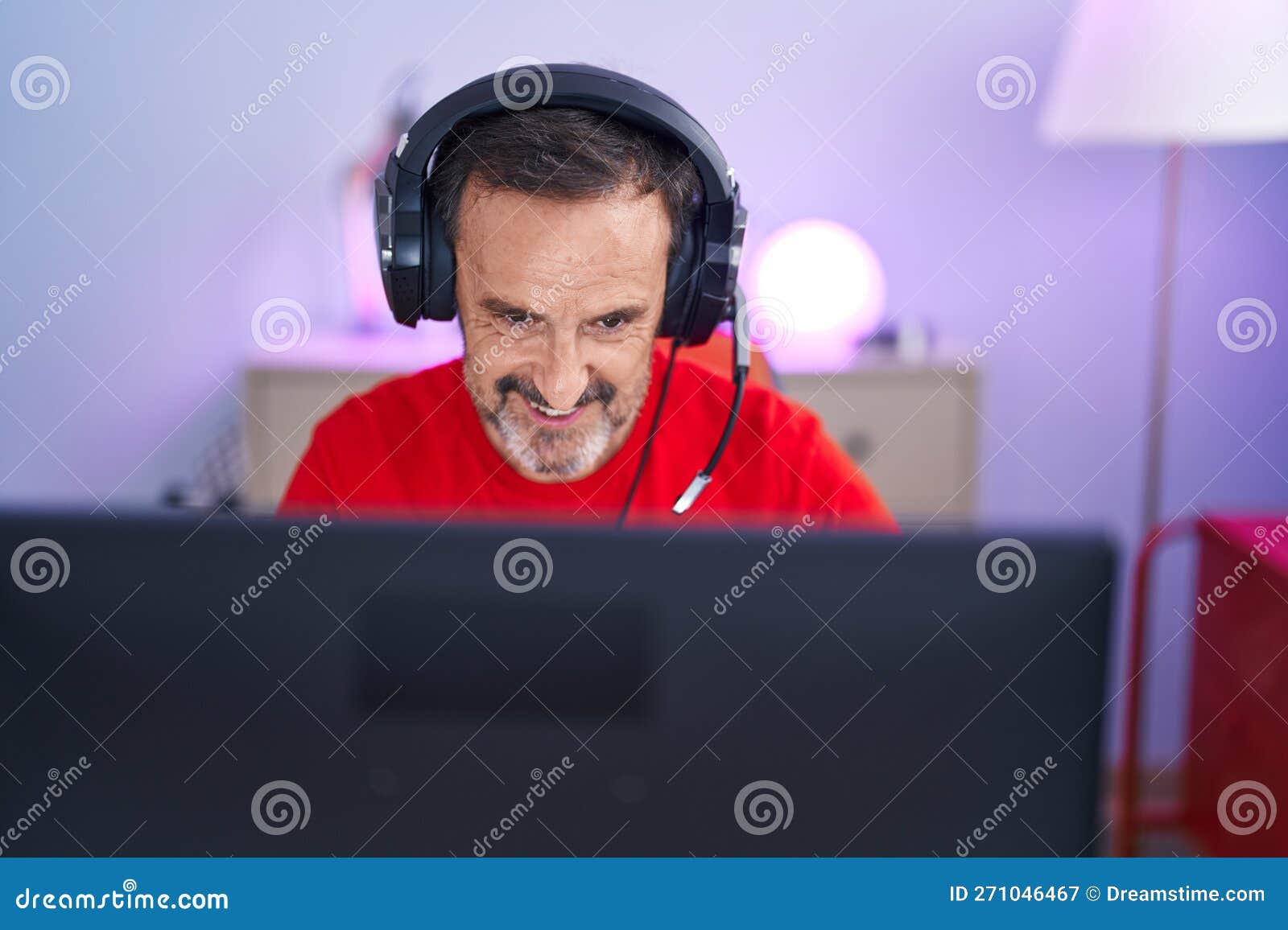 Middle Age Man Streamer Playing Video Game Using Computer at Gaming ...