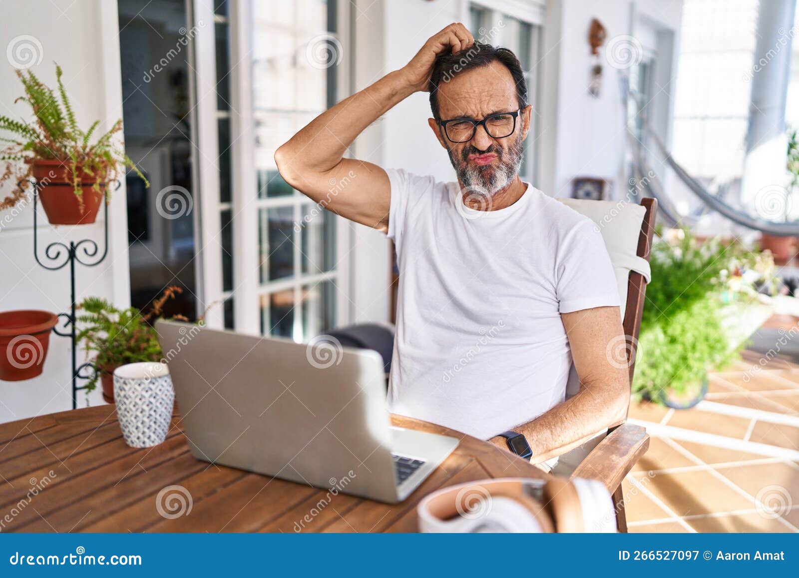 Middle Age Man Using Computer Laptop at Home Confuse and Wondering ...
