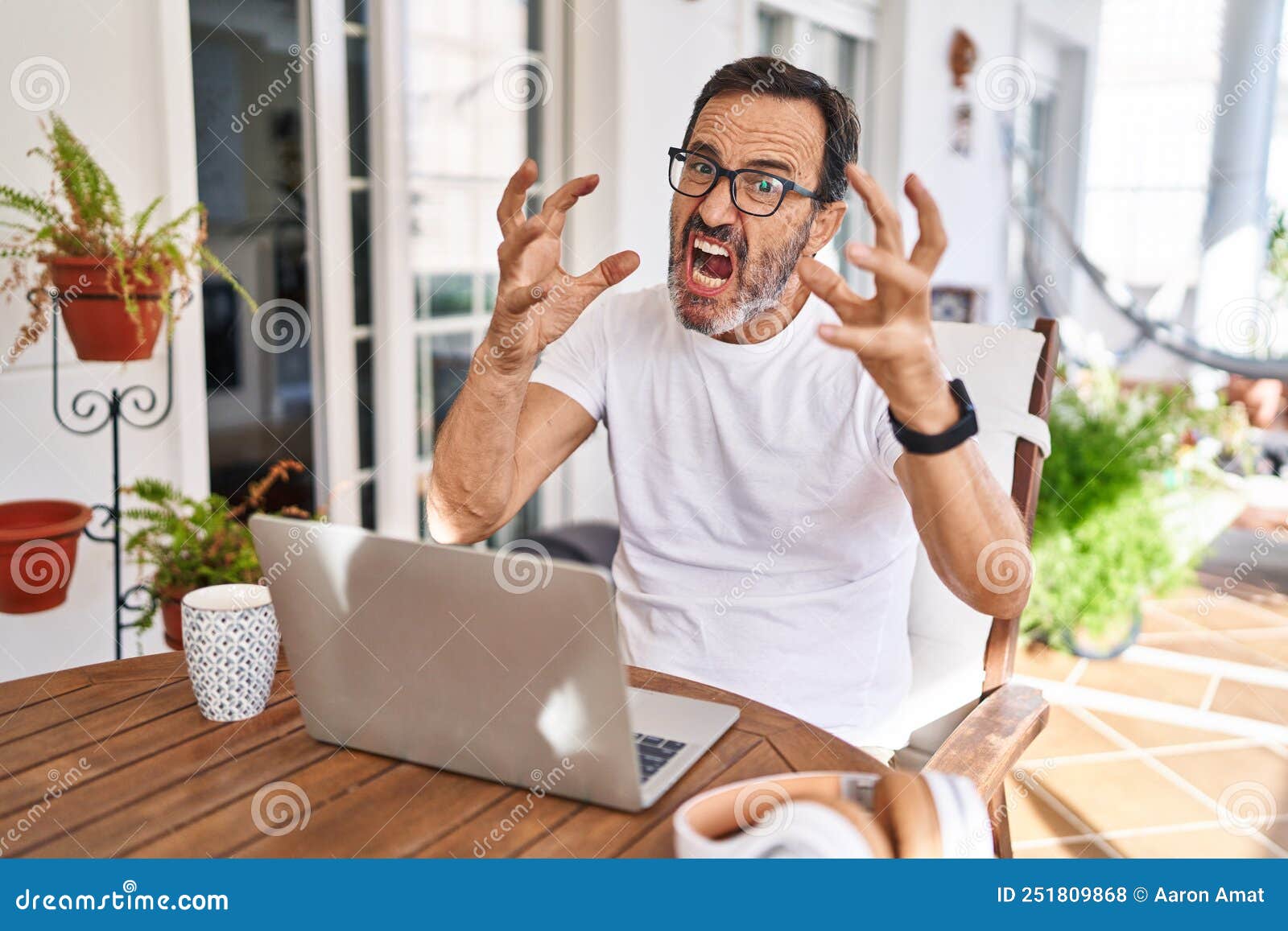 Middle Age Man Using Computer Laptop at Home Shouting Frustrated with ...