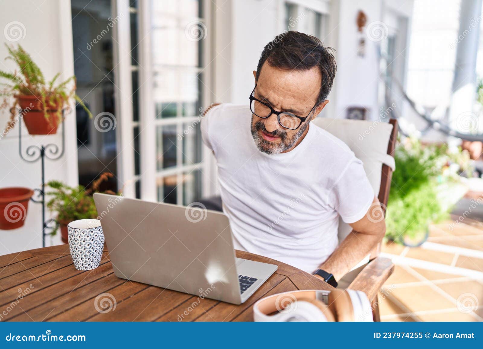 Middle Age Man Using Computer Laptop at Home Suffering of Backache ...