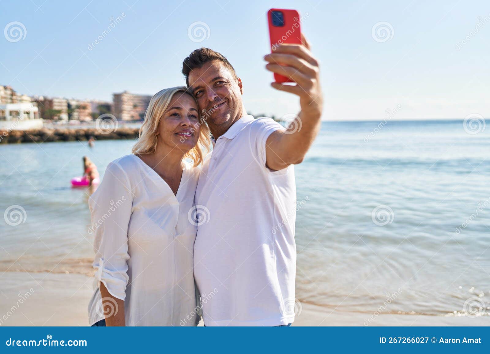Middle Age Man And Woman Couple Hugging Each Other Make Selfie By The