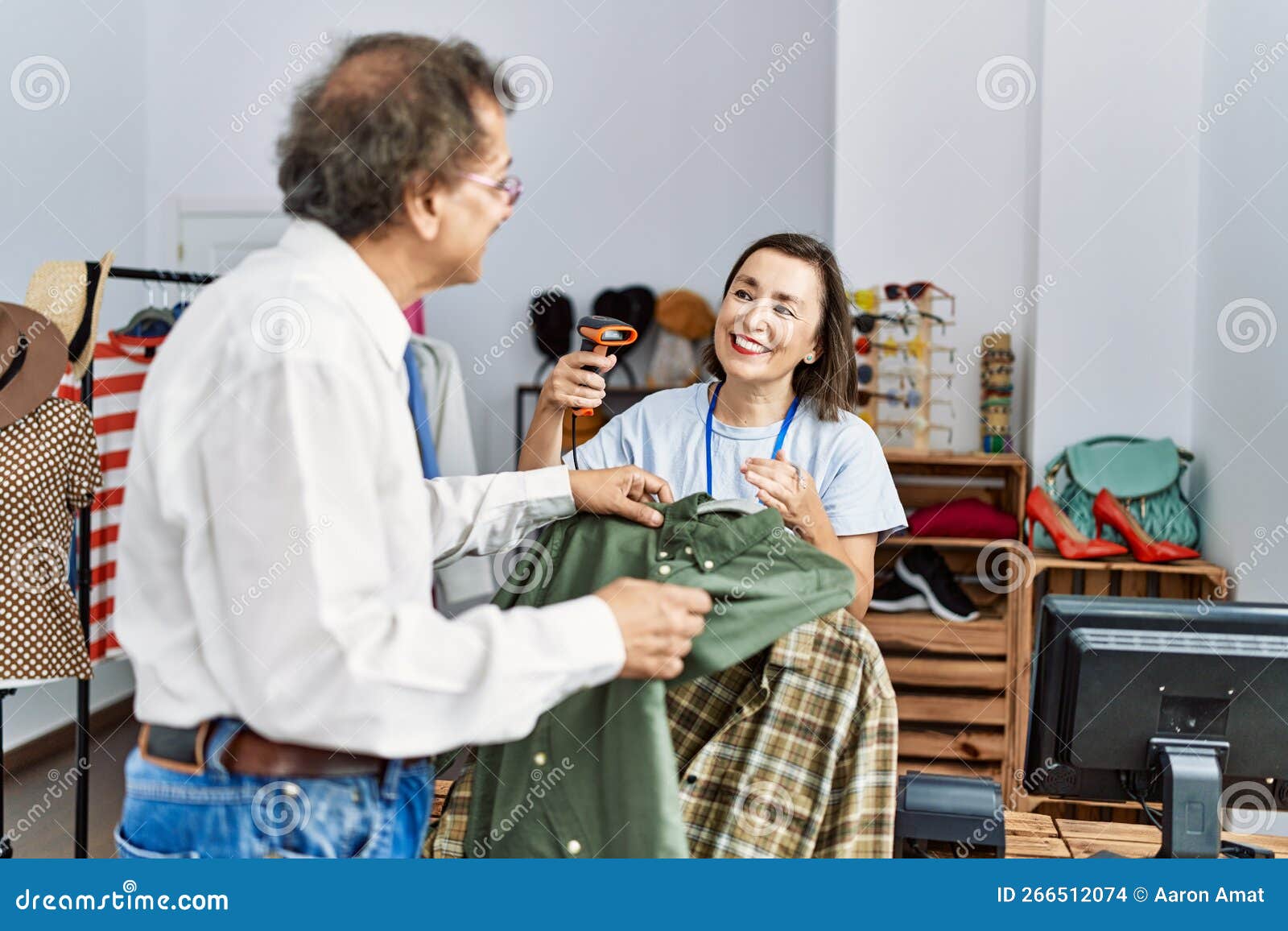 Middle Age Man and Woman Smiling Confident Scanning Clothes Using ...